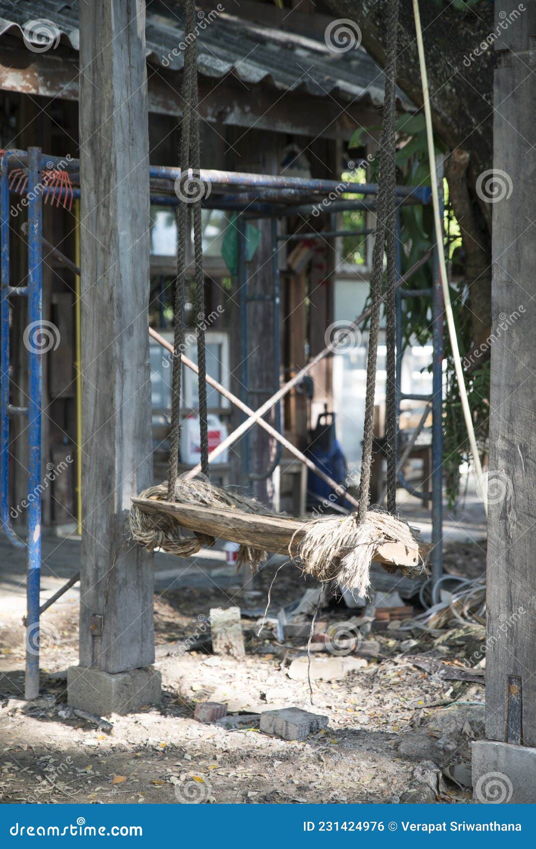 A Wooden Rope Swing in Old House Stock Photo - Image of summer, brown ...