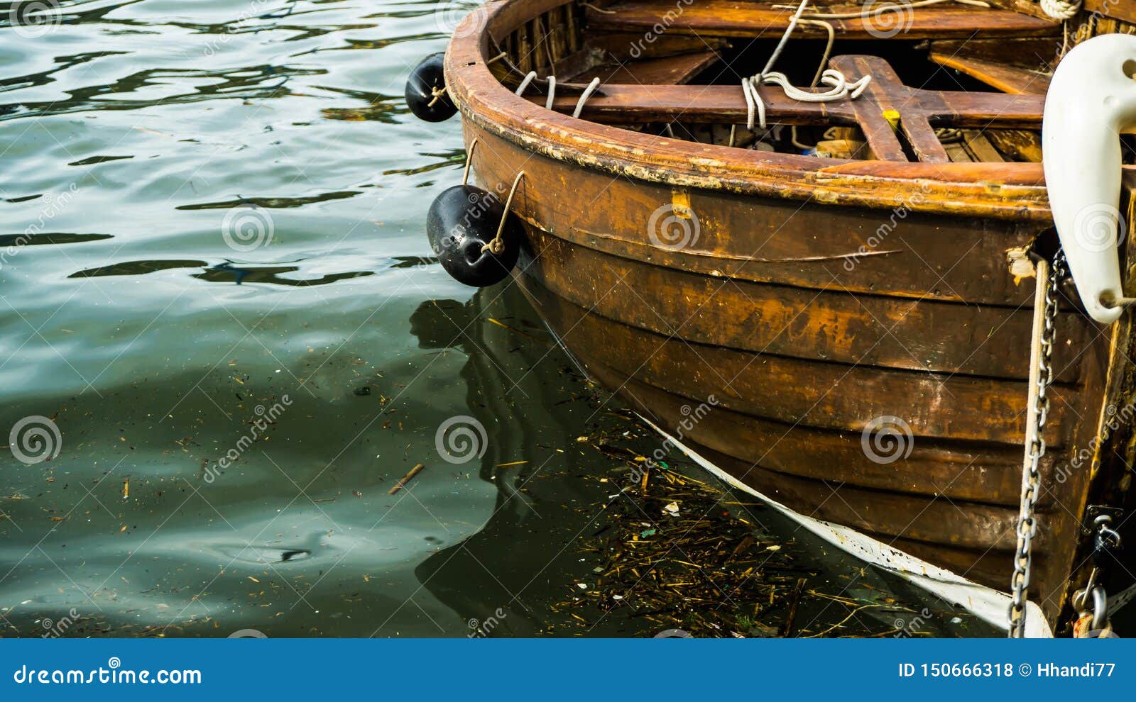 Brown wooden rowboat stock photo. Image of rope, rowing - 150666318