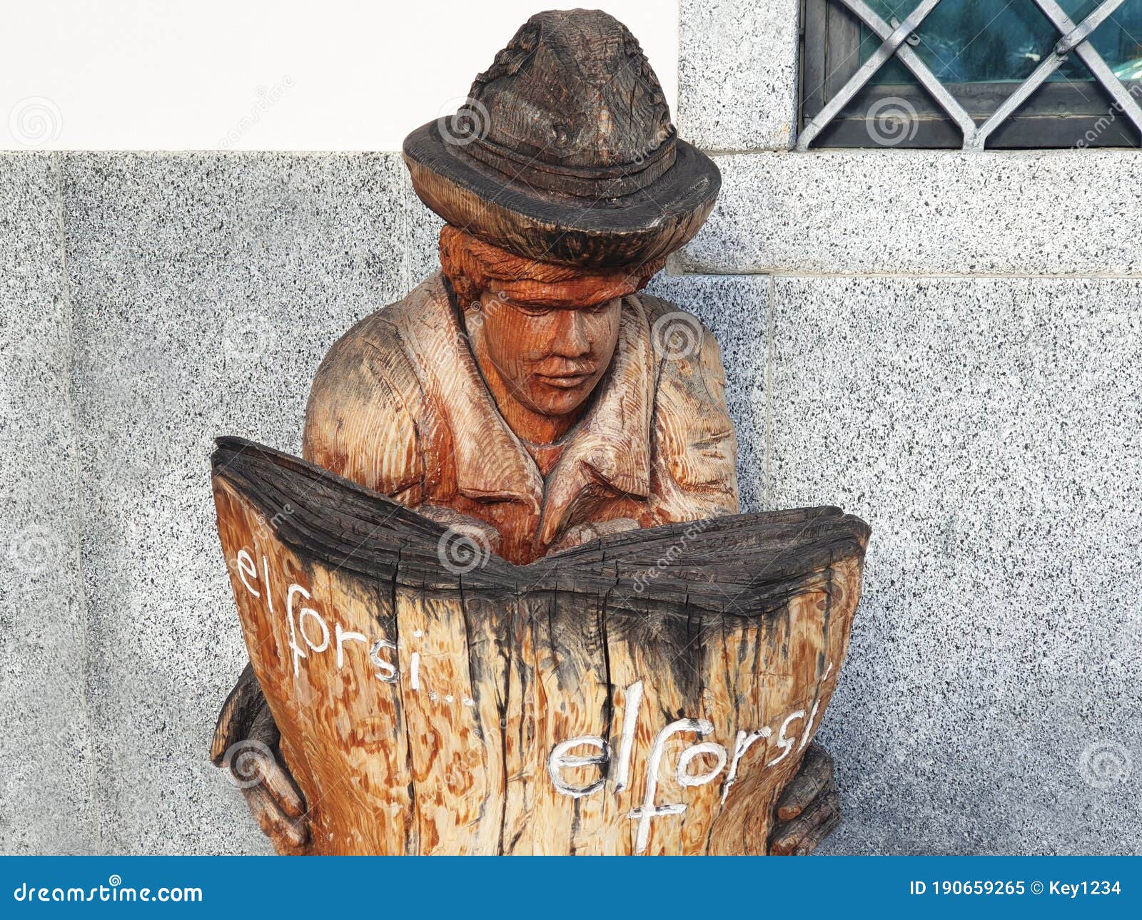 Wooden Sculpture in the Form of a Man Reading a Boo Editorial Image ...