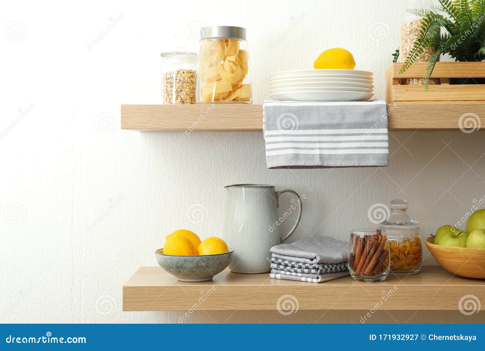 Wooden Shelves with Dishware and Products on Wall. Kitchen Interior ...