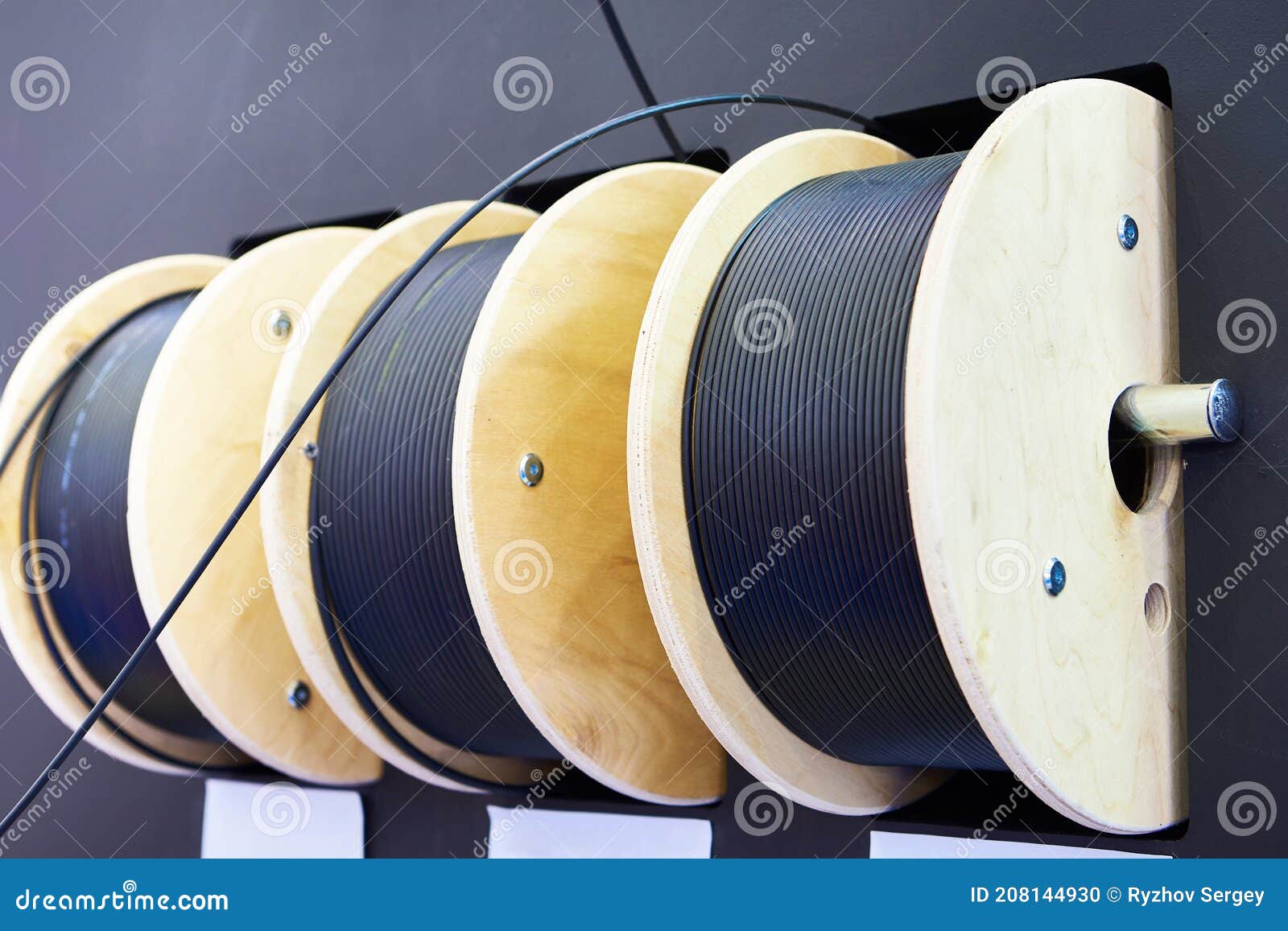 Wooden spools with cables stock photo. Image of installation - 208144930