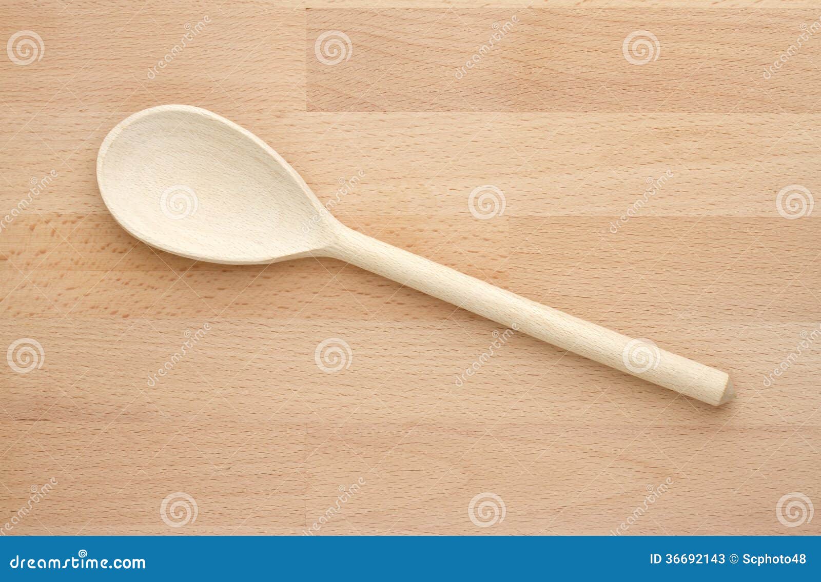 Wooden spoon on a board stock image. Image of simple - 36692143