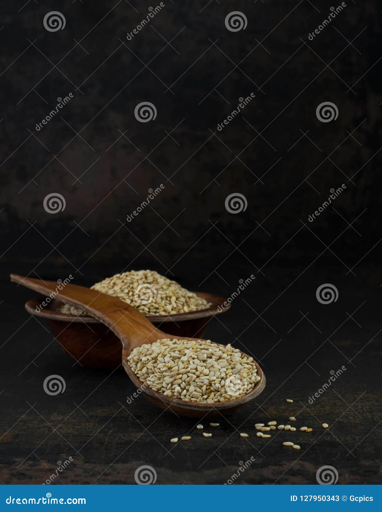 A Wooden Spoon and Bowl of Sesame Seeds Stock Image - Image of light ...