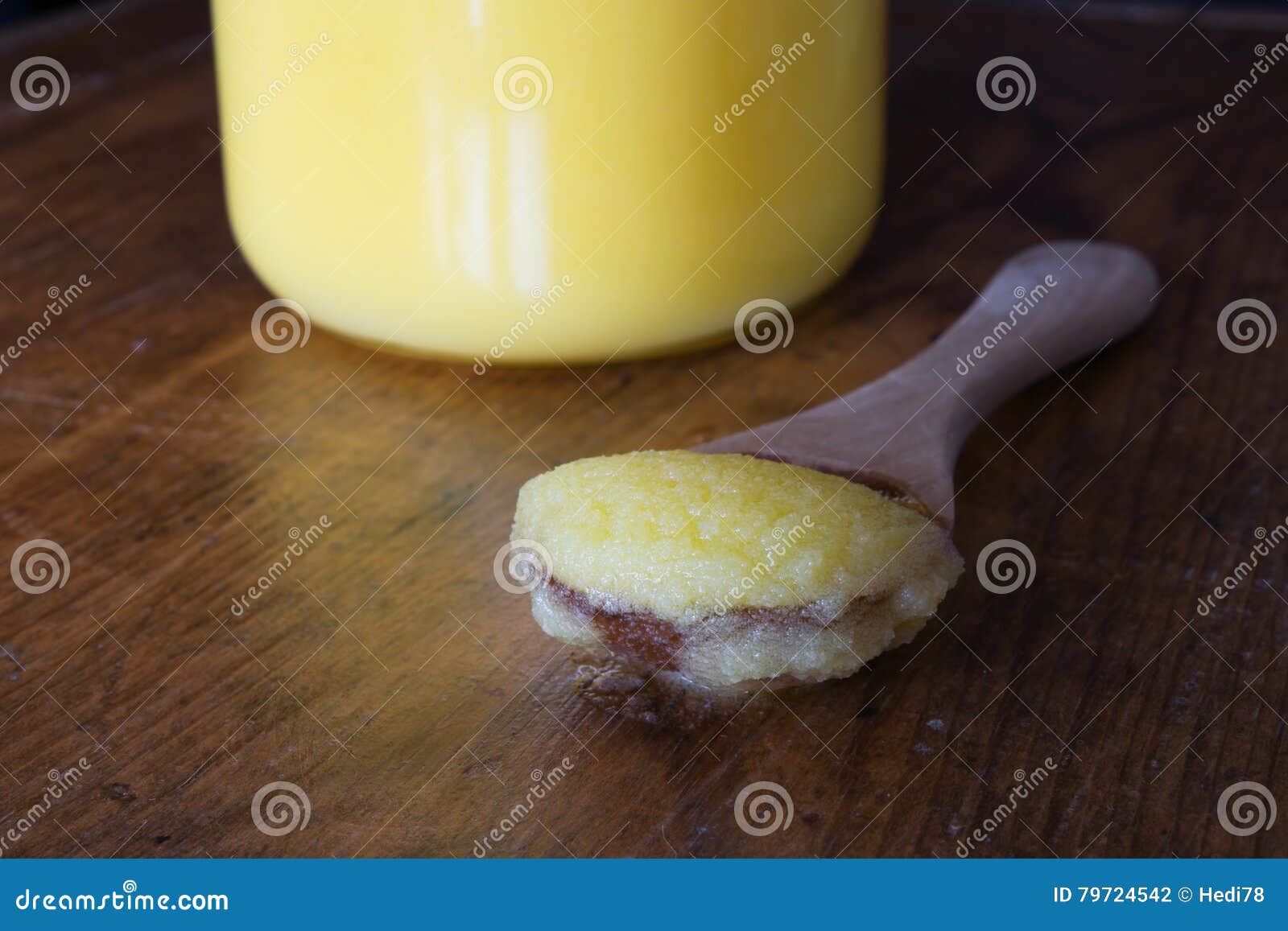 Wooden spoon with ghee stock photo. Image of homemade - 79724542