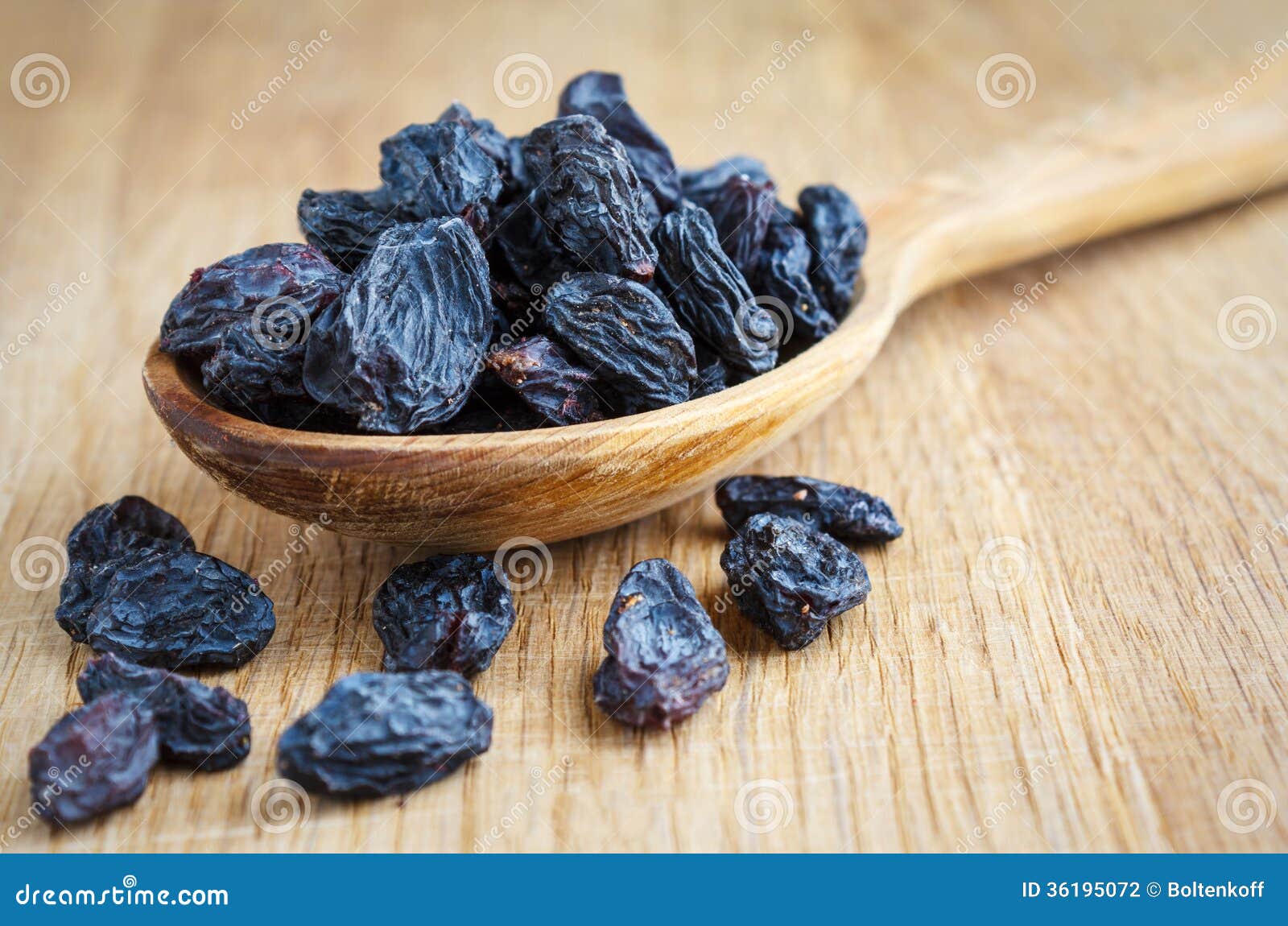 Wooden spoon with raisins stock photo. Image of food - 36195072