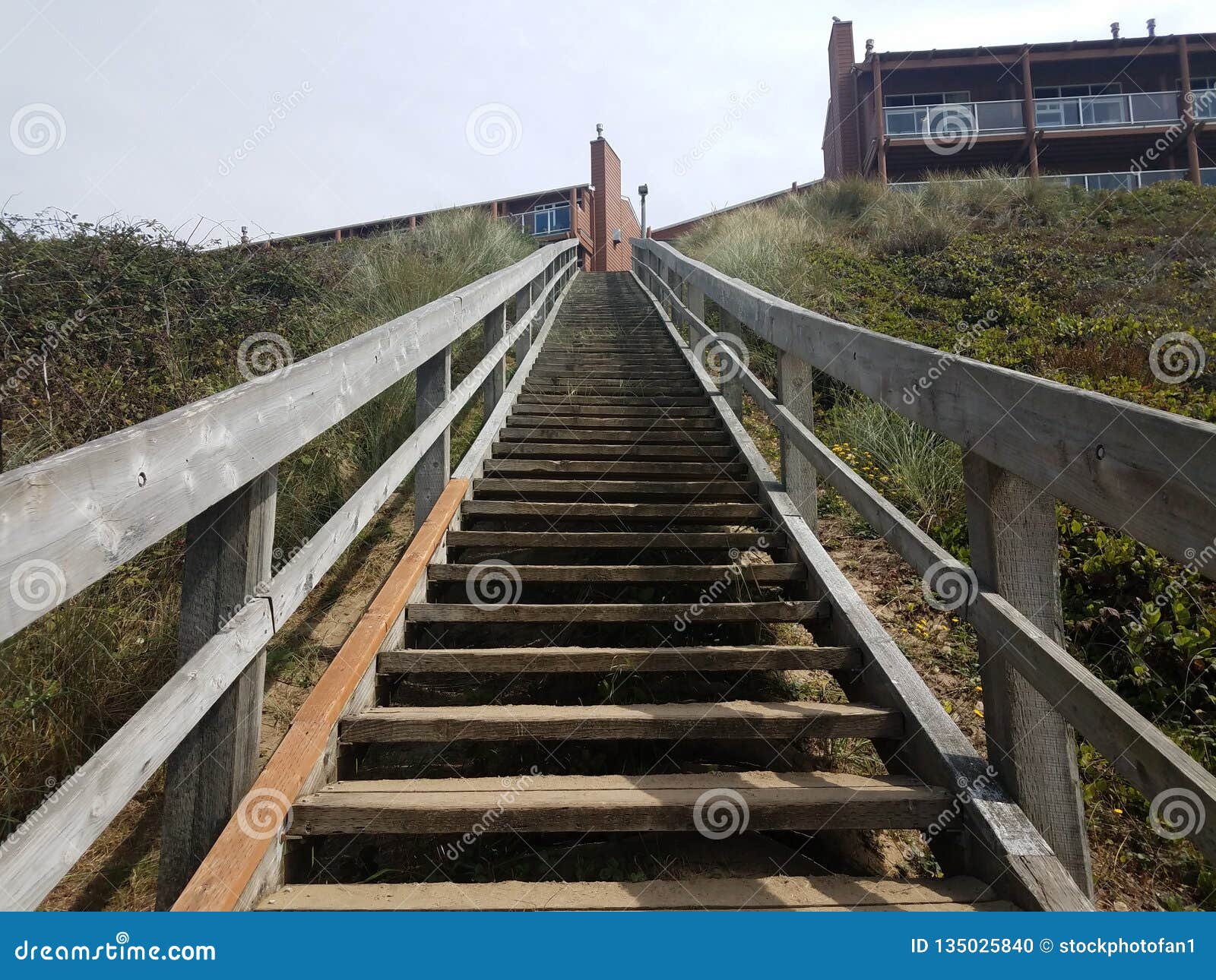 Wooden Stairs Going Up Hill with Railing and Sand Stock Photo - Image ...