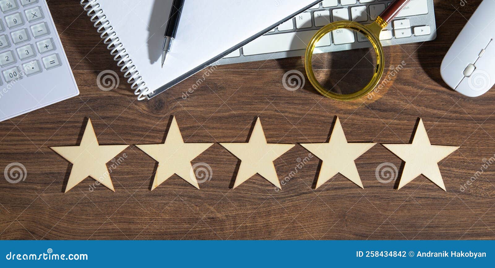 Wooden 5 Stars with a Business Objects on the Table. Increase Rating ...