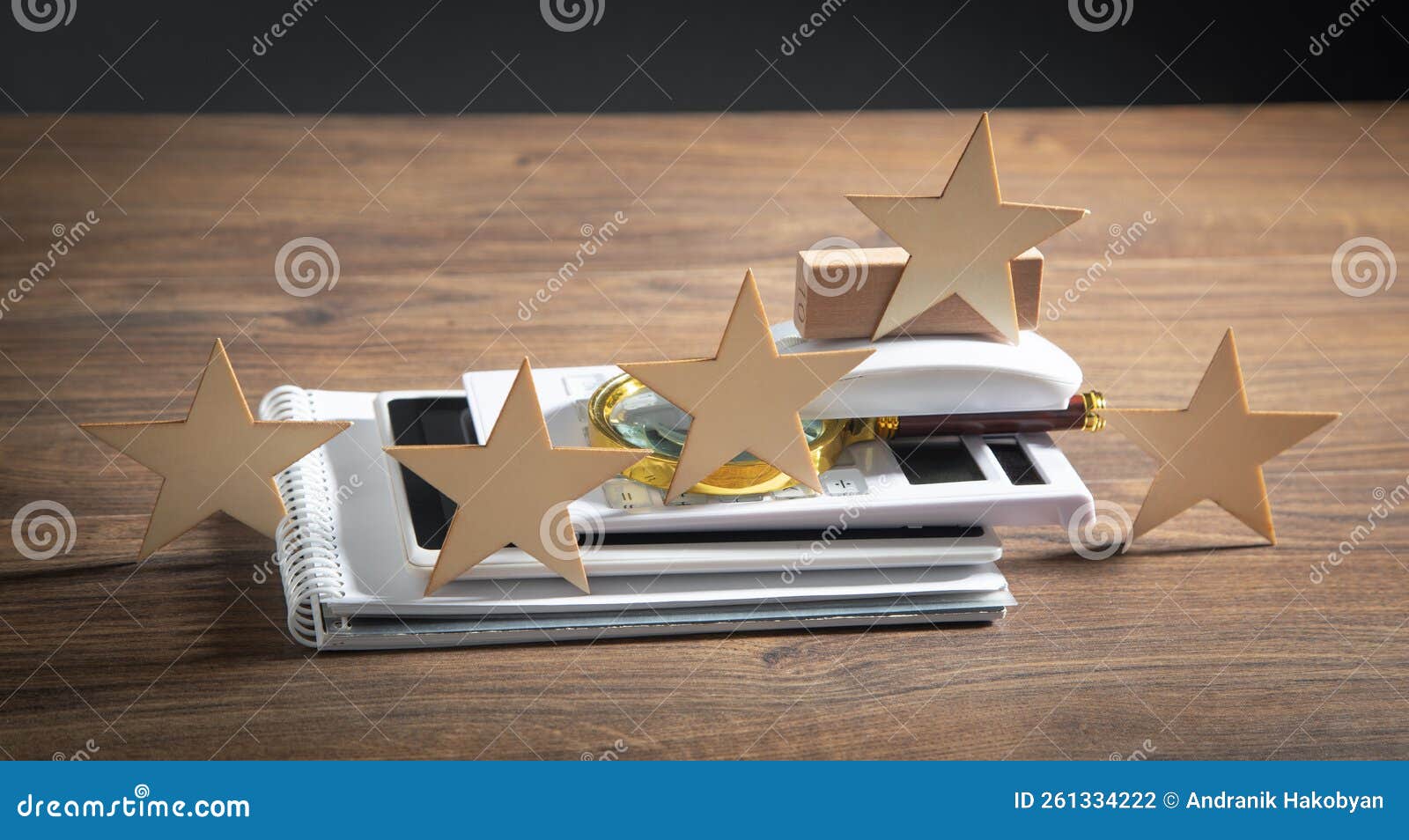 Wooden 5 Stars with a Business Objects on the Table. Increase Rating ...