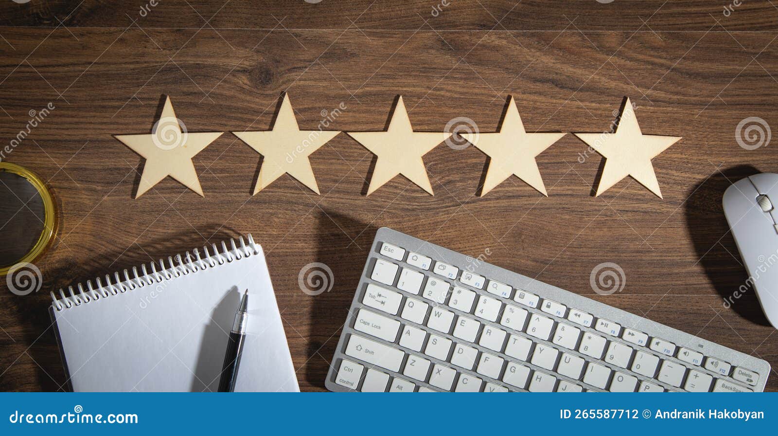 Wooden 5 Stars with a Business Objects on the Table. Increase Rating ...