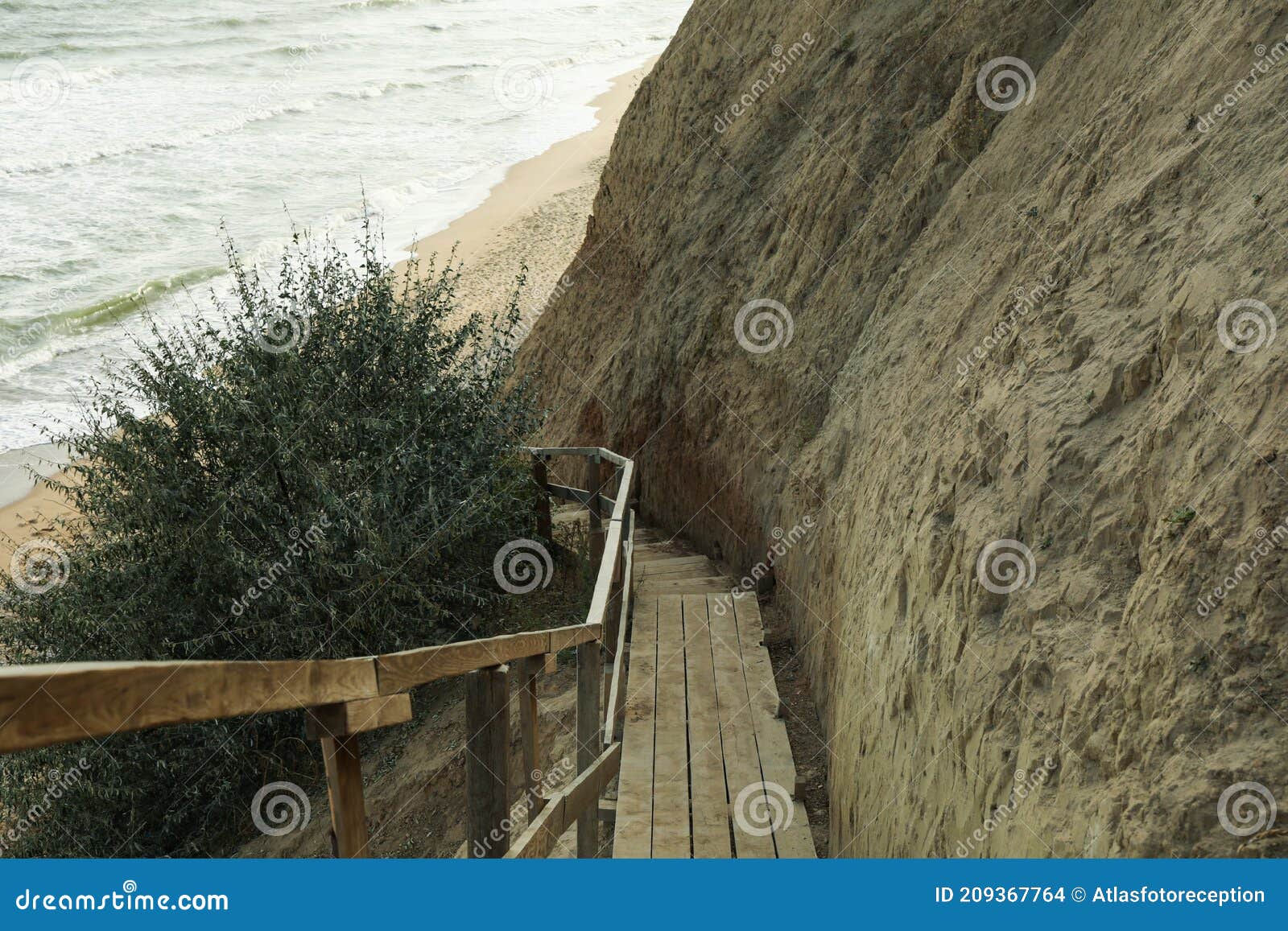 Wooden Steps Near Clay Slope on Sandy Beach Stock Photo - Image of ...