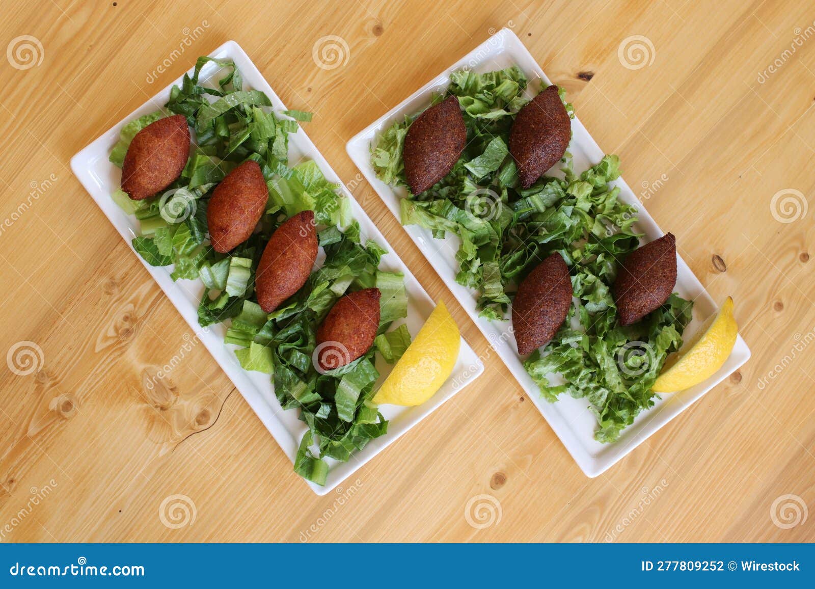 Wooden Table Adorned with a Traditional Dish of Ishli Kufta Stock Photo ...