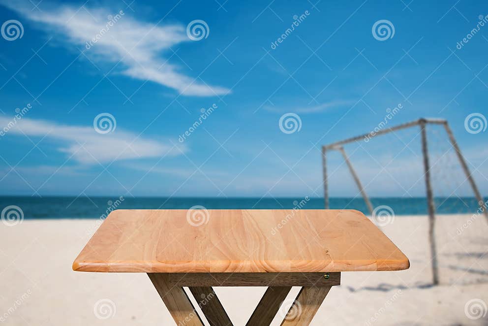 Wooden Table with Beach Background Stock Photo - Image of blue, fold ...