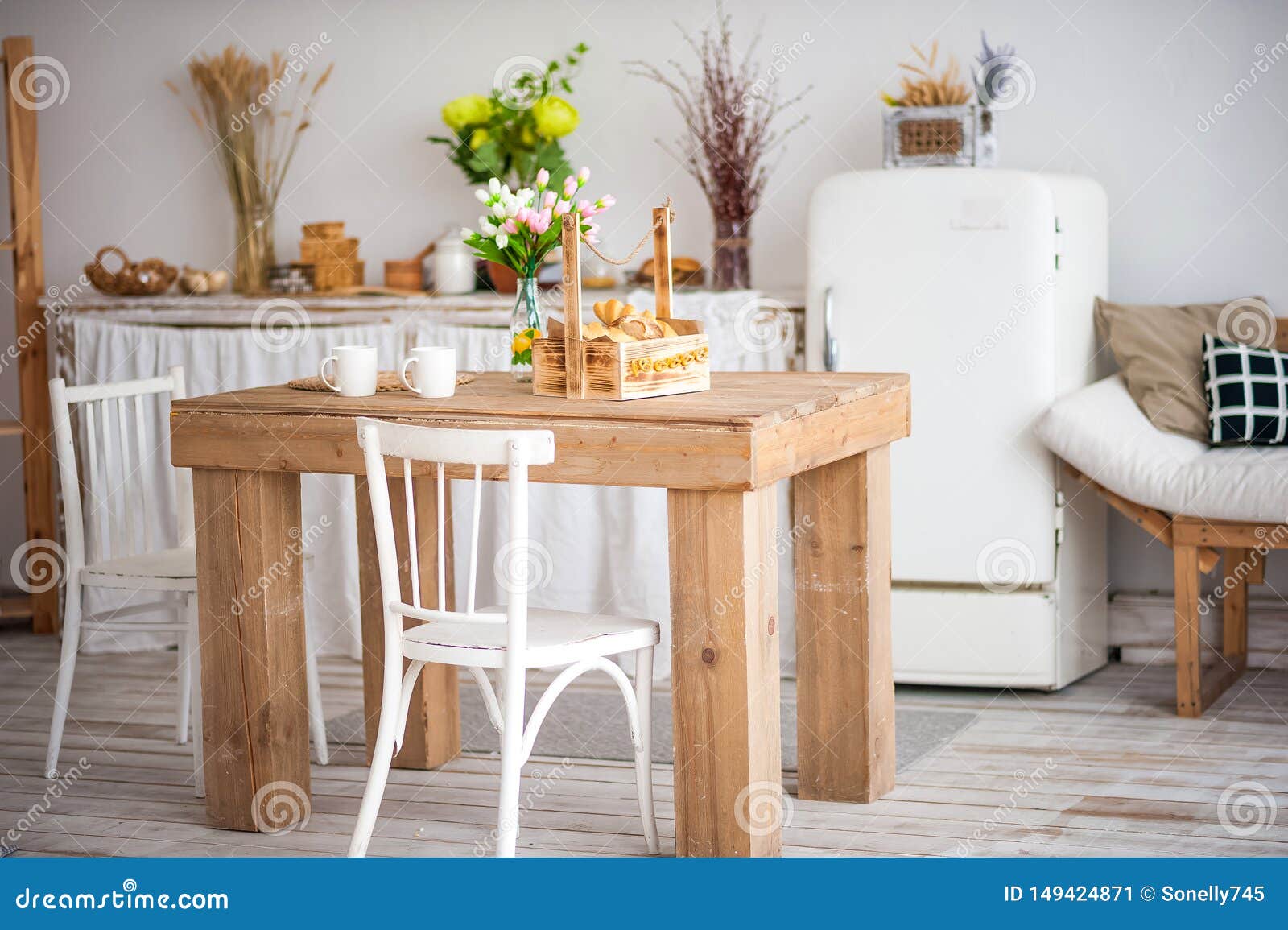 Wooden Table in a Bright Rustic-style Kitchen. Scandinavian Style in ...