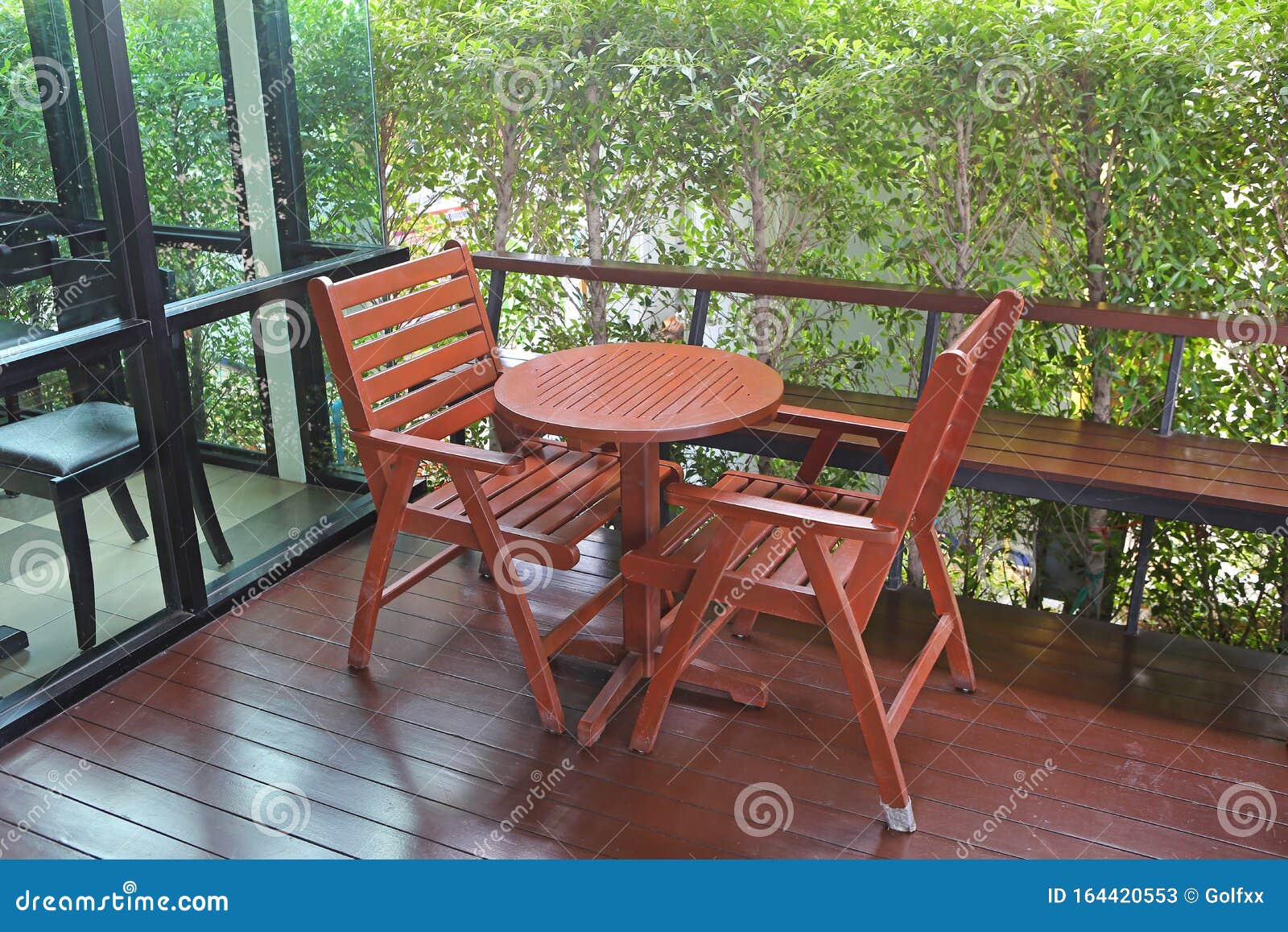Wooden Table and Chairs on Balcony at Coffee Shop Stock Image - Image ...