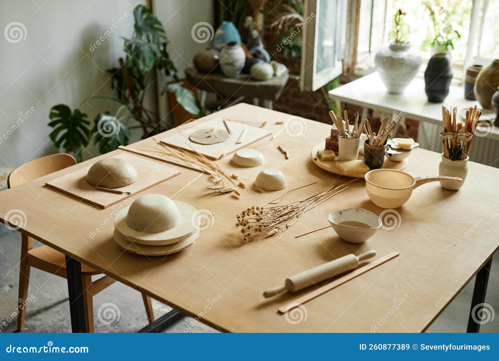 Wooden Table in Cozy Pottery Studio Setup for Ceramics Workshop Stock ...
