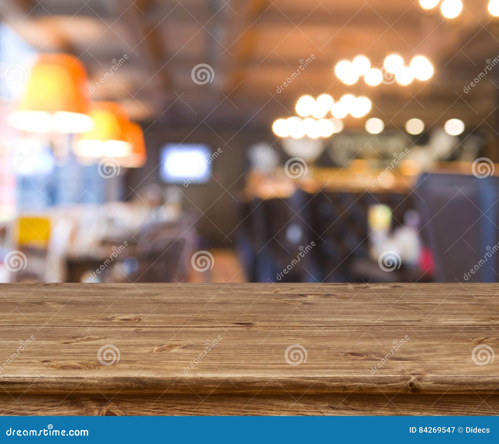 Wooden Table in Front of Abstract Blurred Resturant Lights Background ...