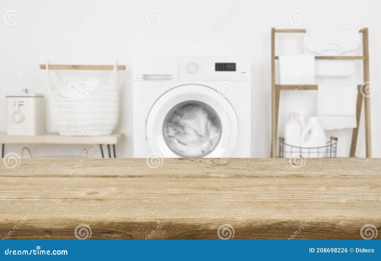 Wooden Table in Front of Washing Machine Loaded with Laundry Stock ...