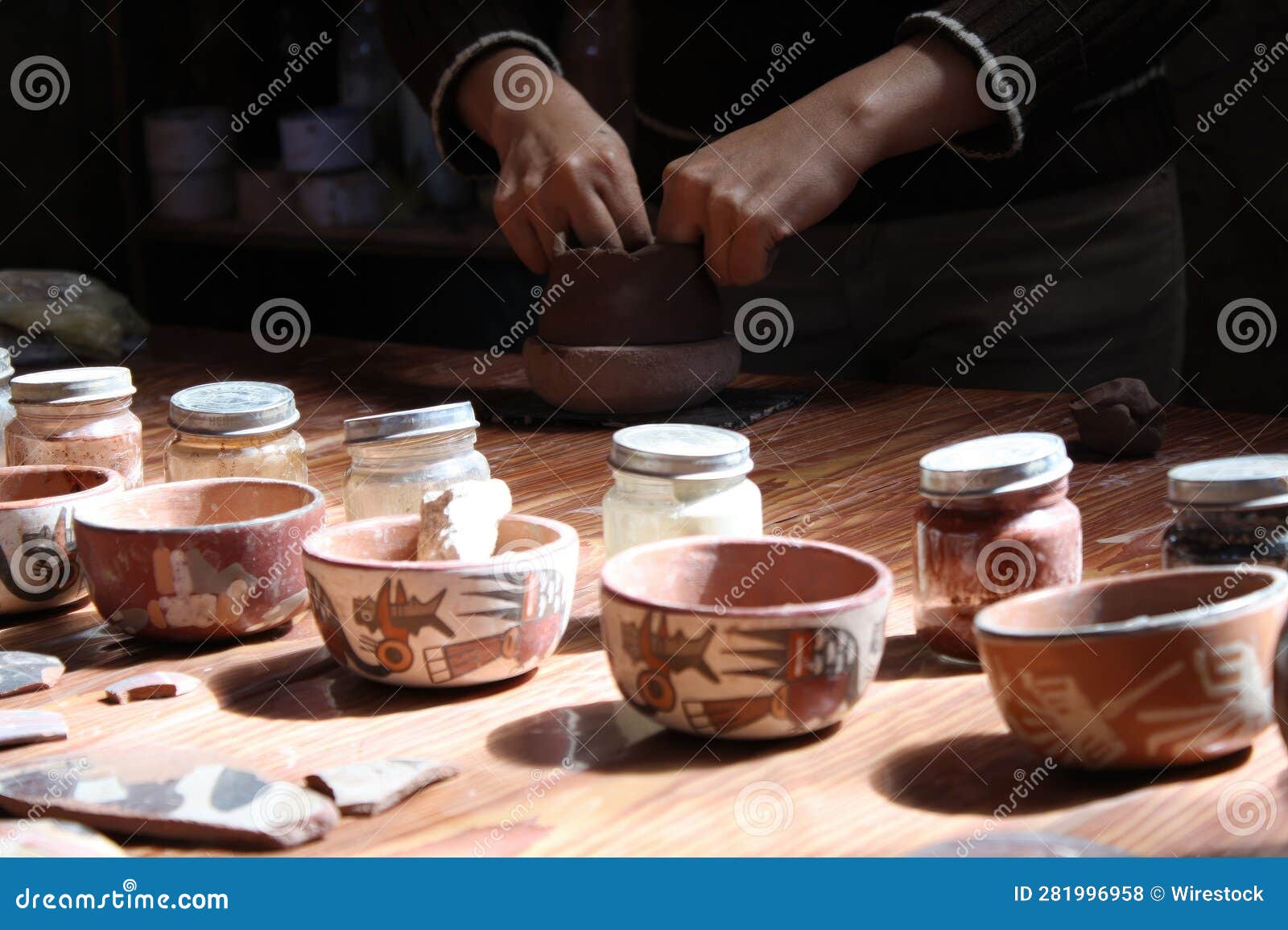 Wooden Table with Traditional Peruvian Pottery Samples. Stock Photo ...