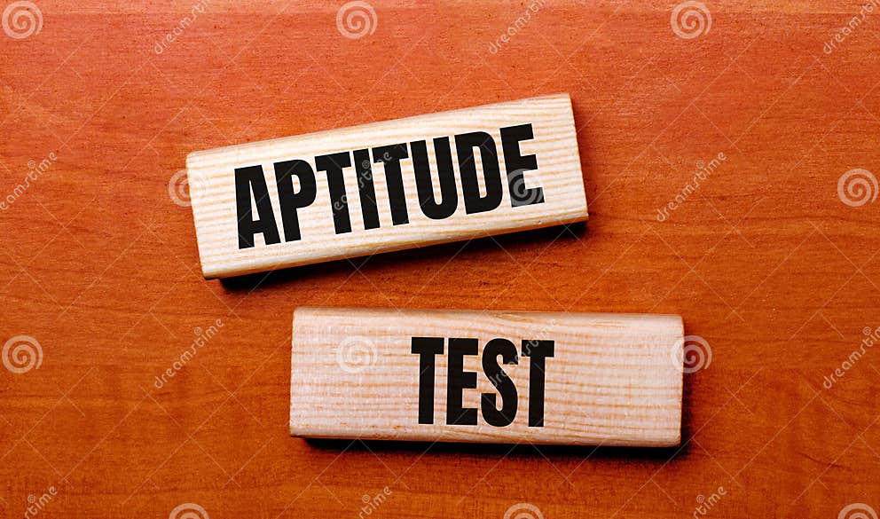 On a Wooden Table are Two Wooden Blocks with the Text Question APTITUDE ...