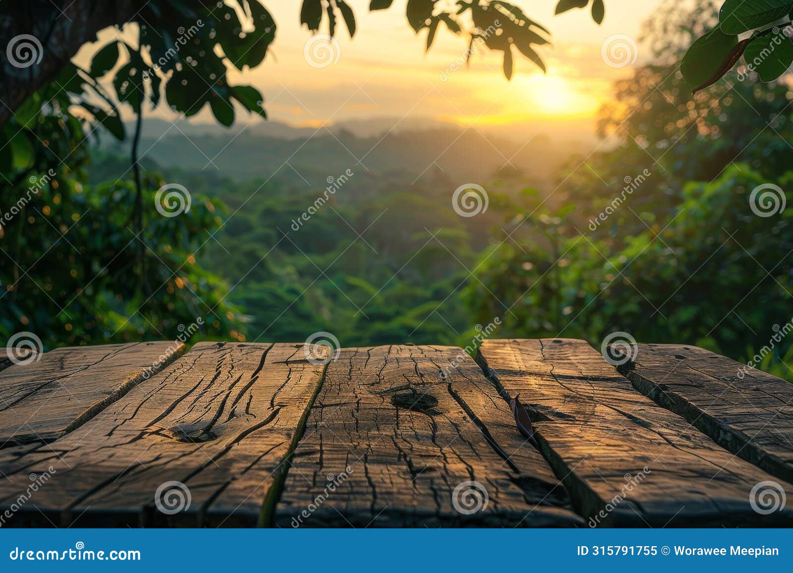A Wooden Table with a View of the Mountains and a Sunset in the ...