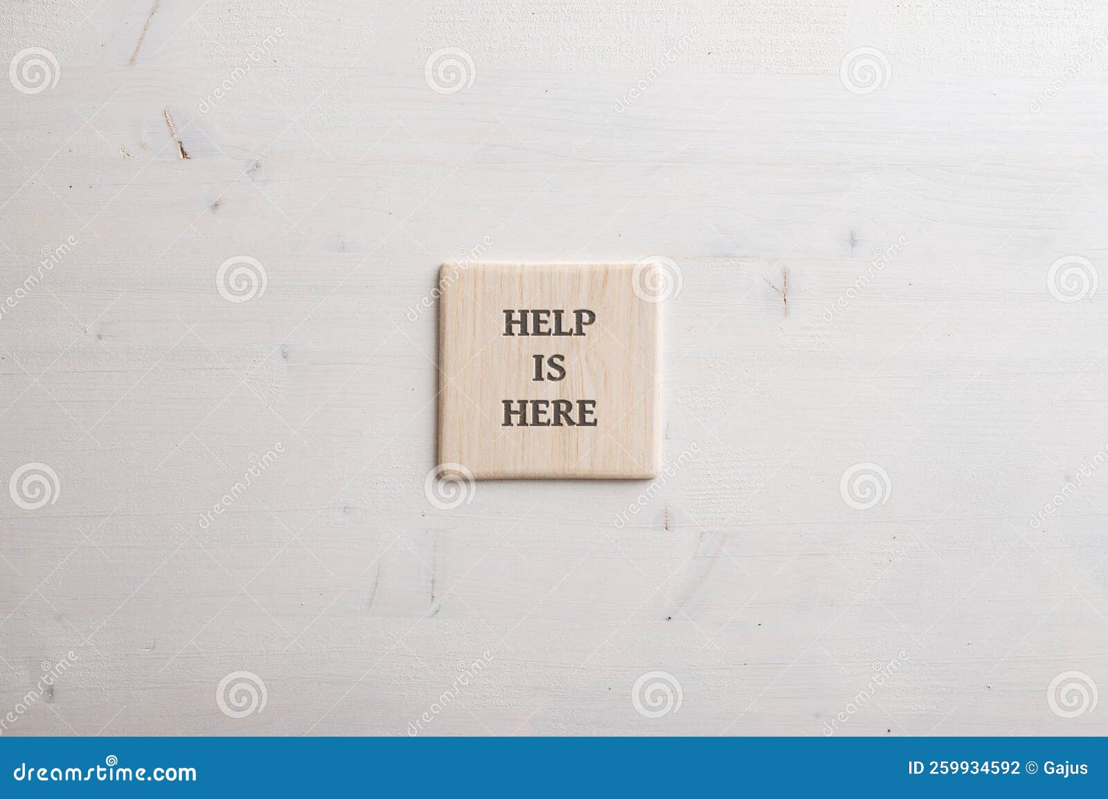 Wooden Tile with a Help is Here Sign Written on it Stock Photo - Image ...