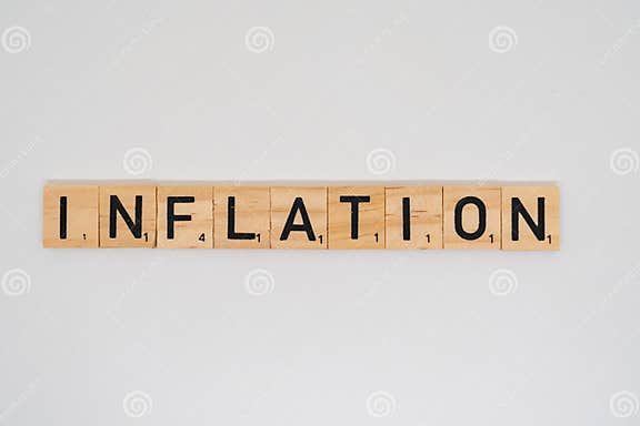 Wooden Tile Spelling the Word Inflation Isolated on a White Background ... Wooden Tile Spelling the Word Inflation Isolated on a White Background ...