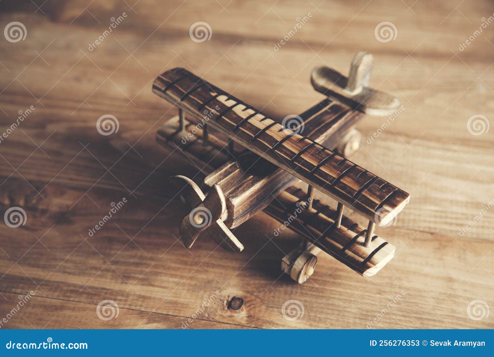 Wooden toy plane on table stock image. Image of plane - 256276353