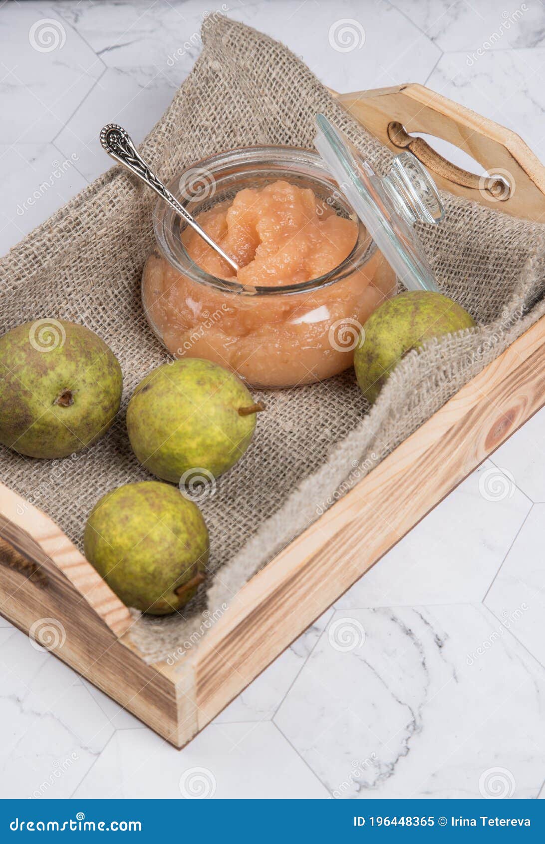 Wooden Tray with a Jar of Mashed Pears and Fresh Pears on a Light ...