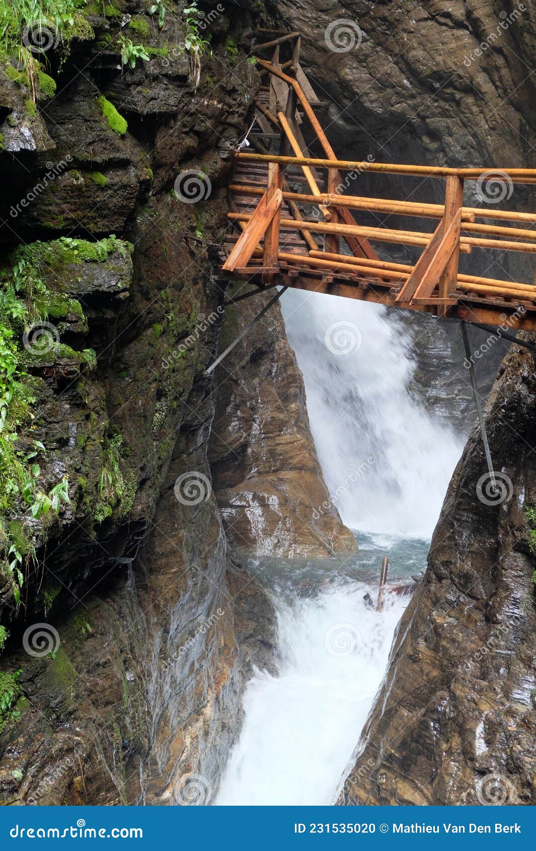 Wooden Walkpath As Bridge Over Cascading Waterfall Stock Photo - Image ...