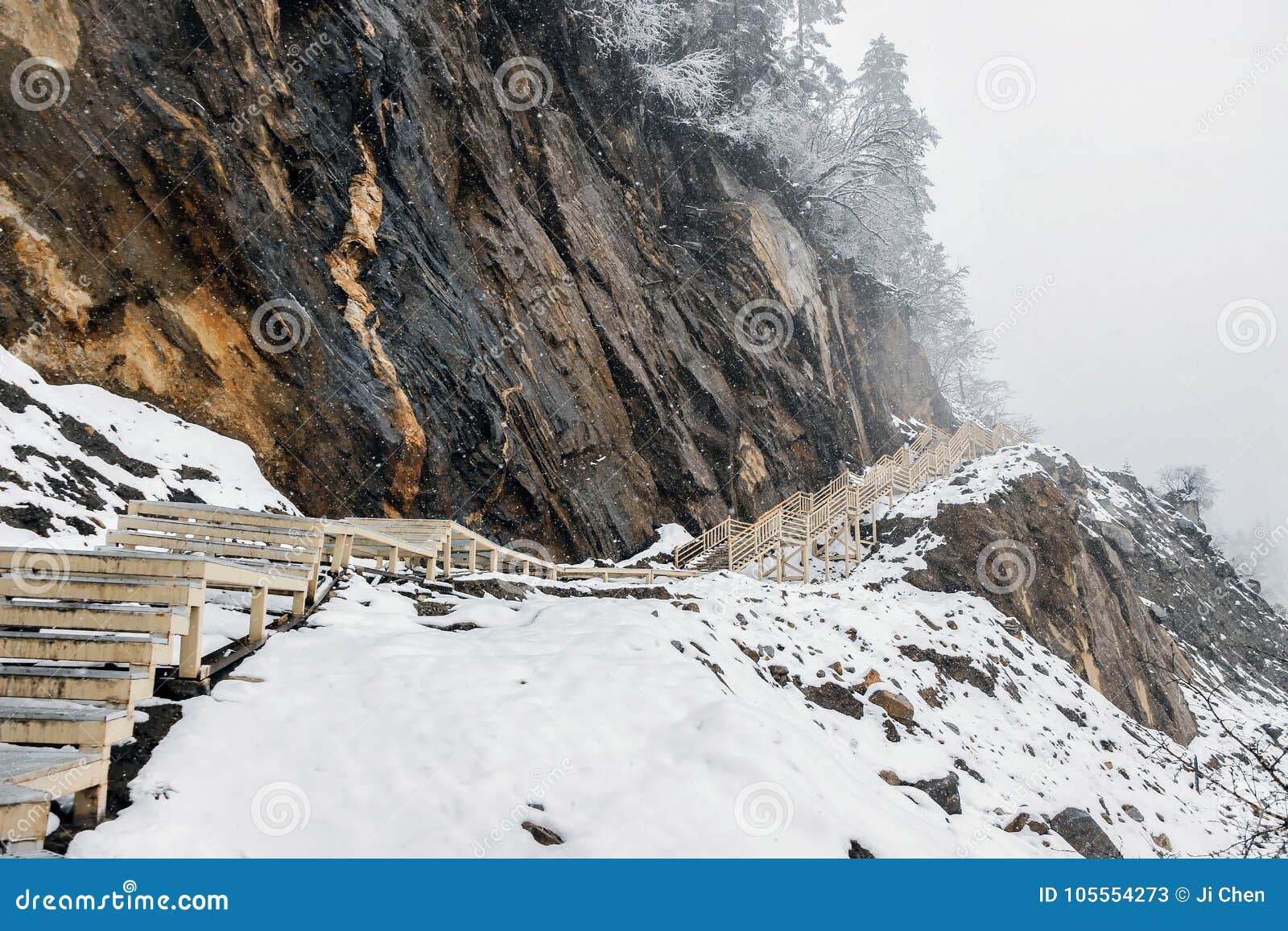 Walkway on cliff in snow stock image. Image of white - 105554273