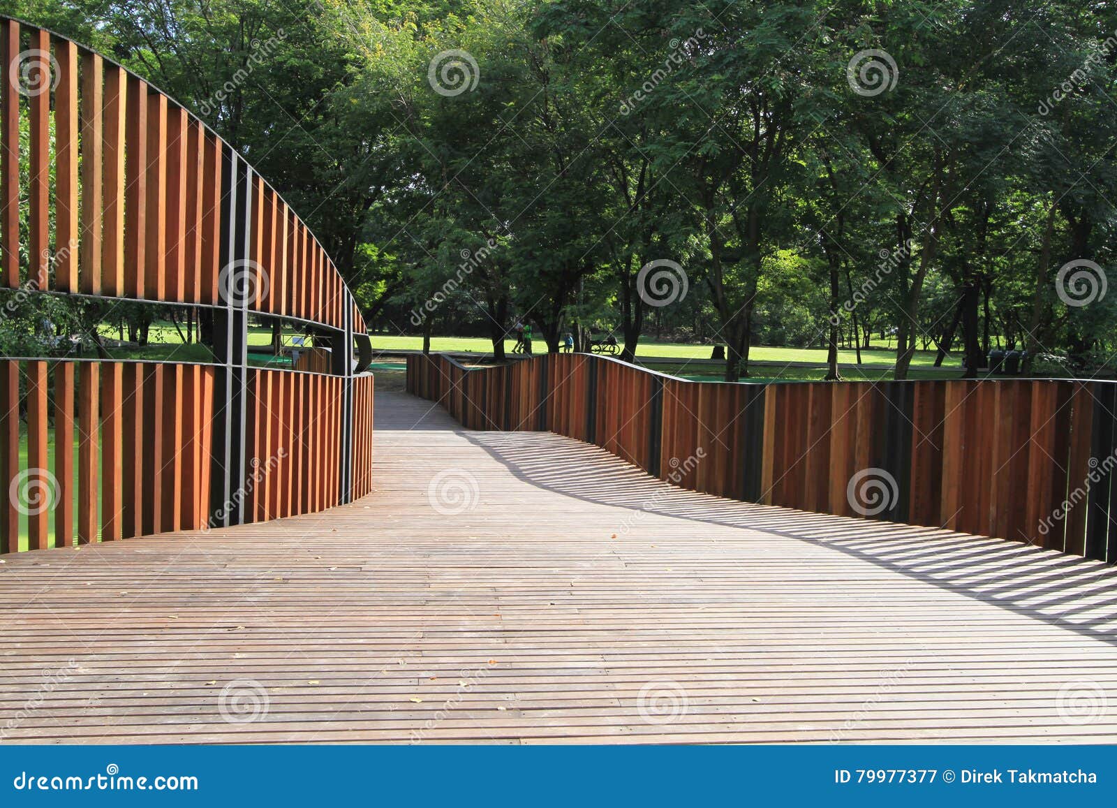 Wooden walkway in the park stock image. Image of area - 79977377