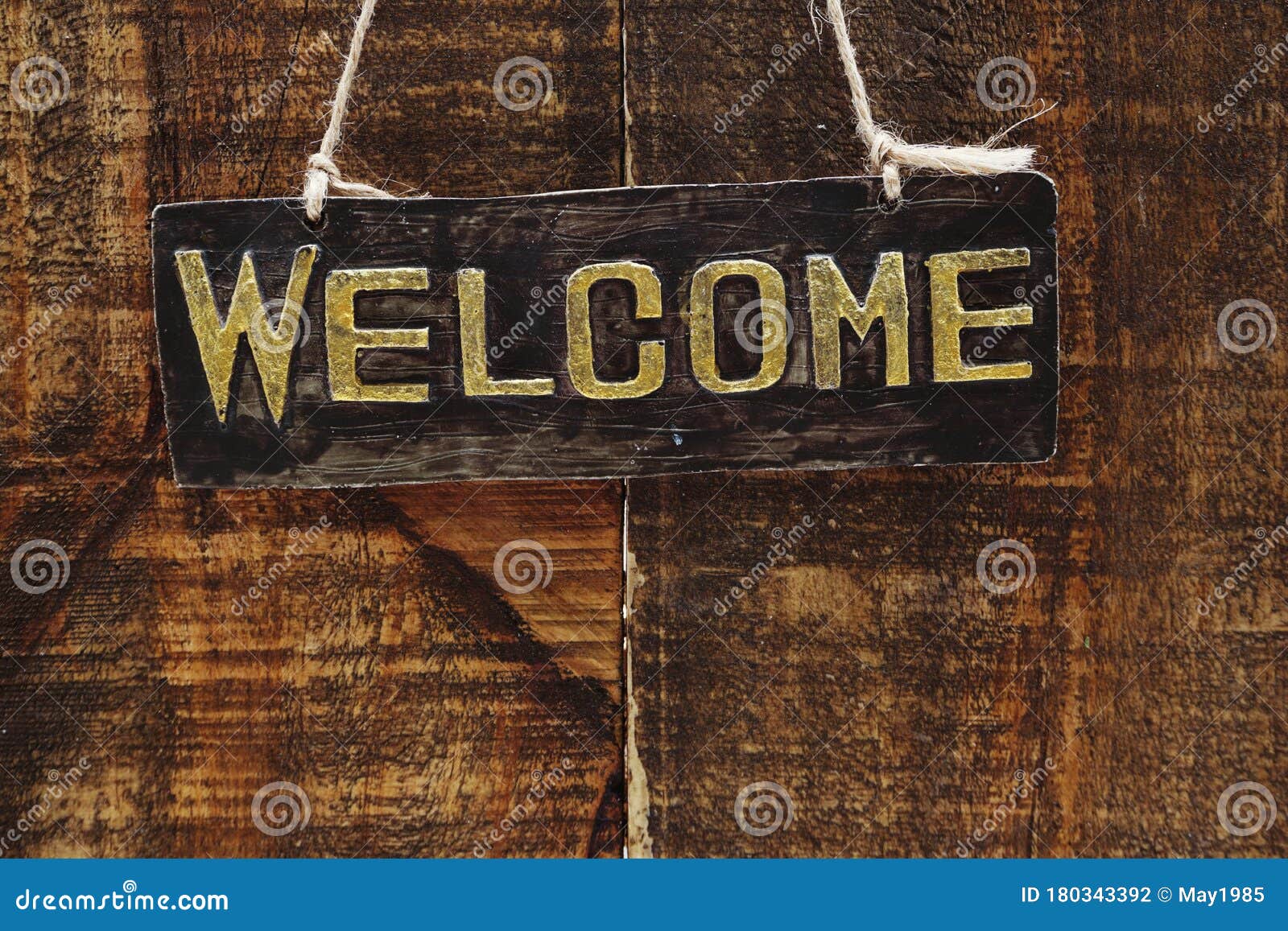 Wooden Welcome Sign Hanging on Space Wooden Background Stock Photo ...