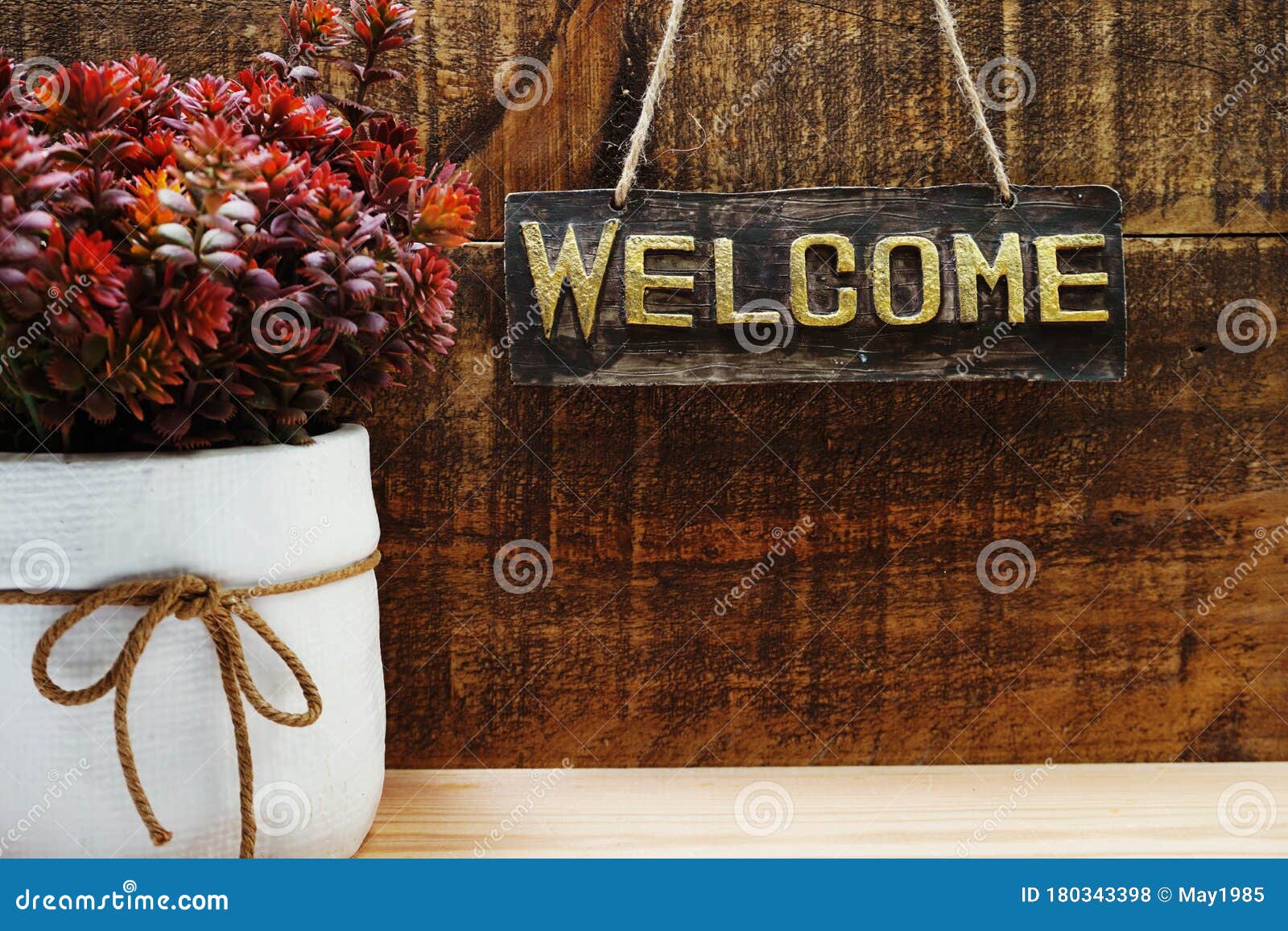 Wooden Welcome Sign Hanging on Space Wooden Background Stock Photo ...
