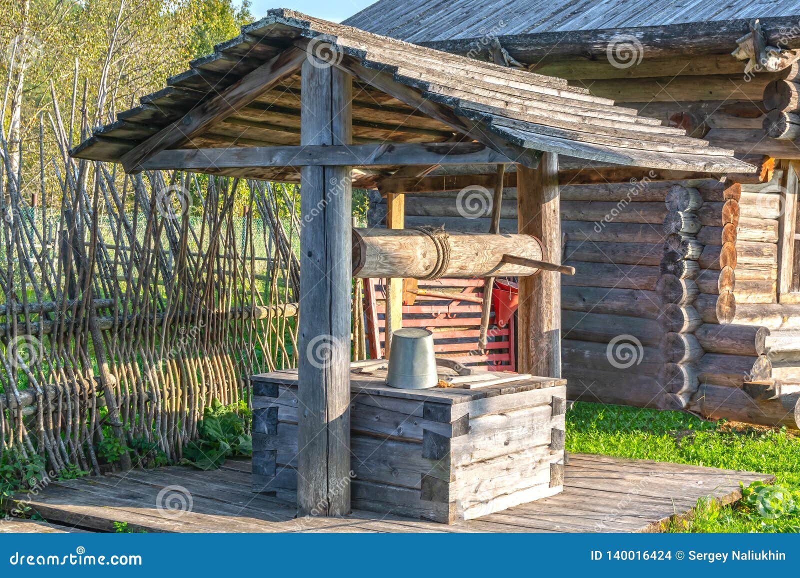 Wooden well under the roof stock photo. Image of spring - 140016424