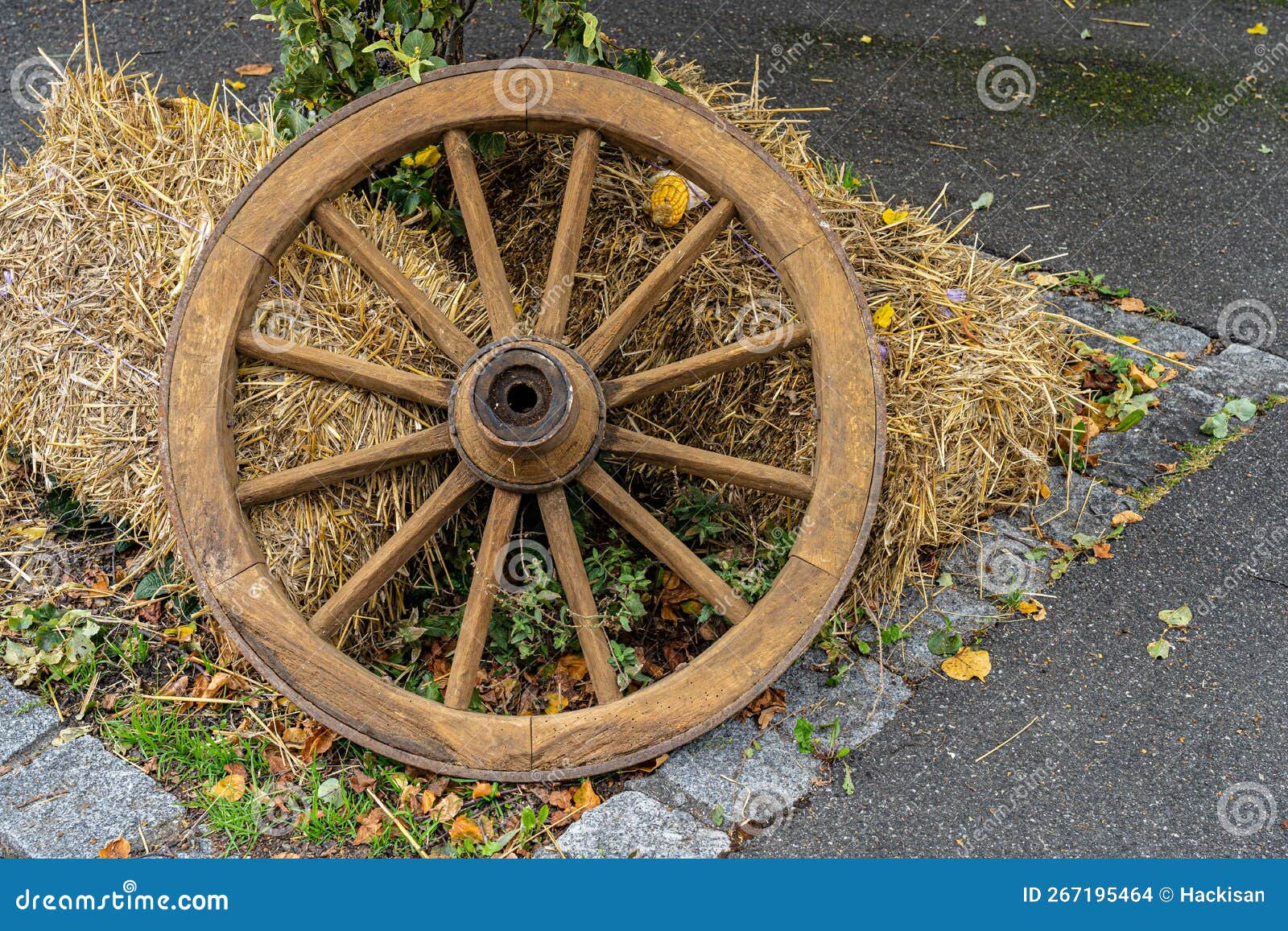 Wooden Wheel and Straw As Decoration on the Ground Stock Photo - Image ...
