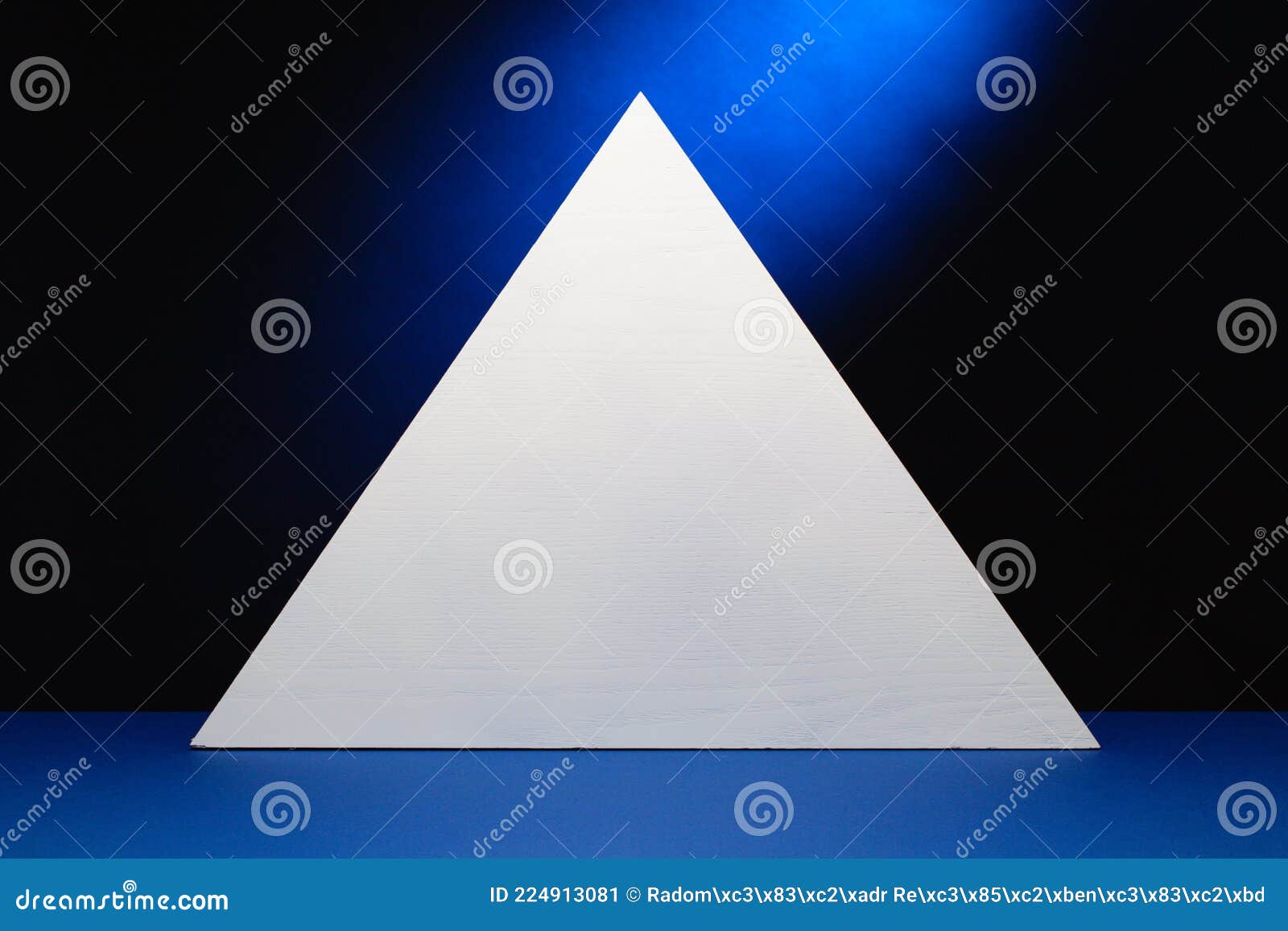Wooden White Triange on the Blue Table Stock Image - Image of simple ...