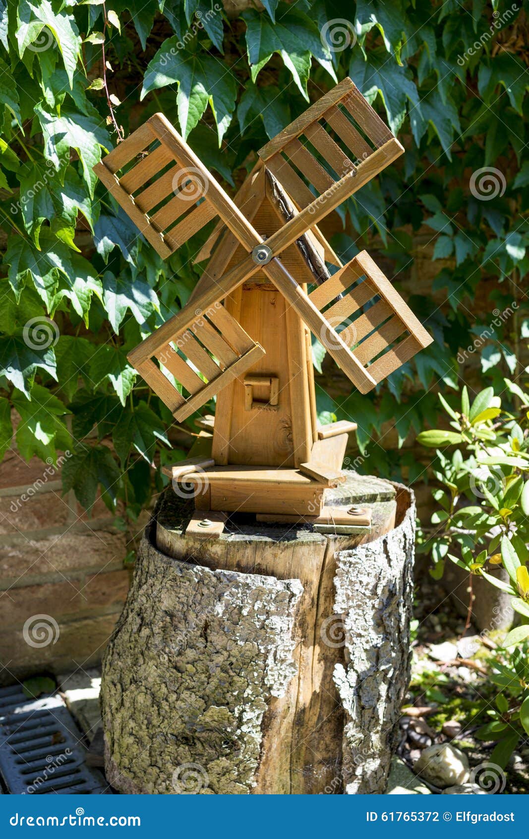 Wooden Windmill on a Tree Trunk Stock Photo - Image of decoration, tree ...
