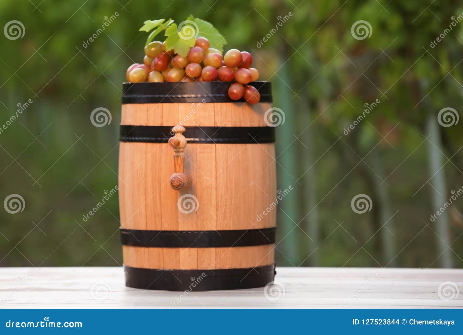 Wooden Wine Barrel with Ripe Grapes on Table Stock Photo - Image of ...