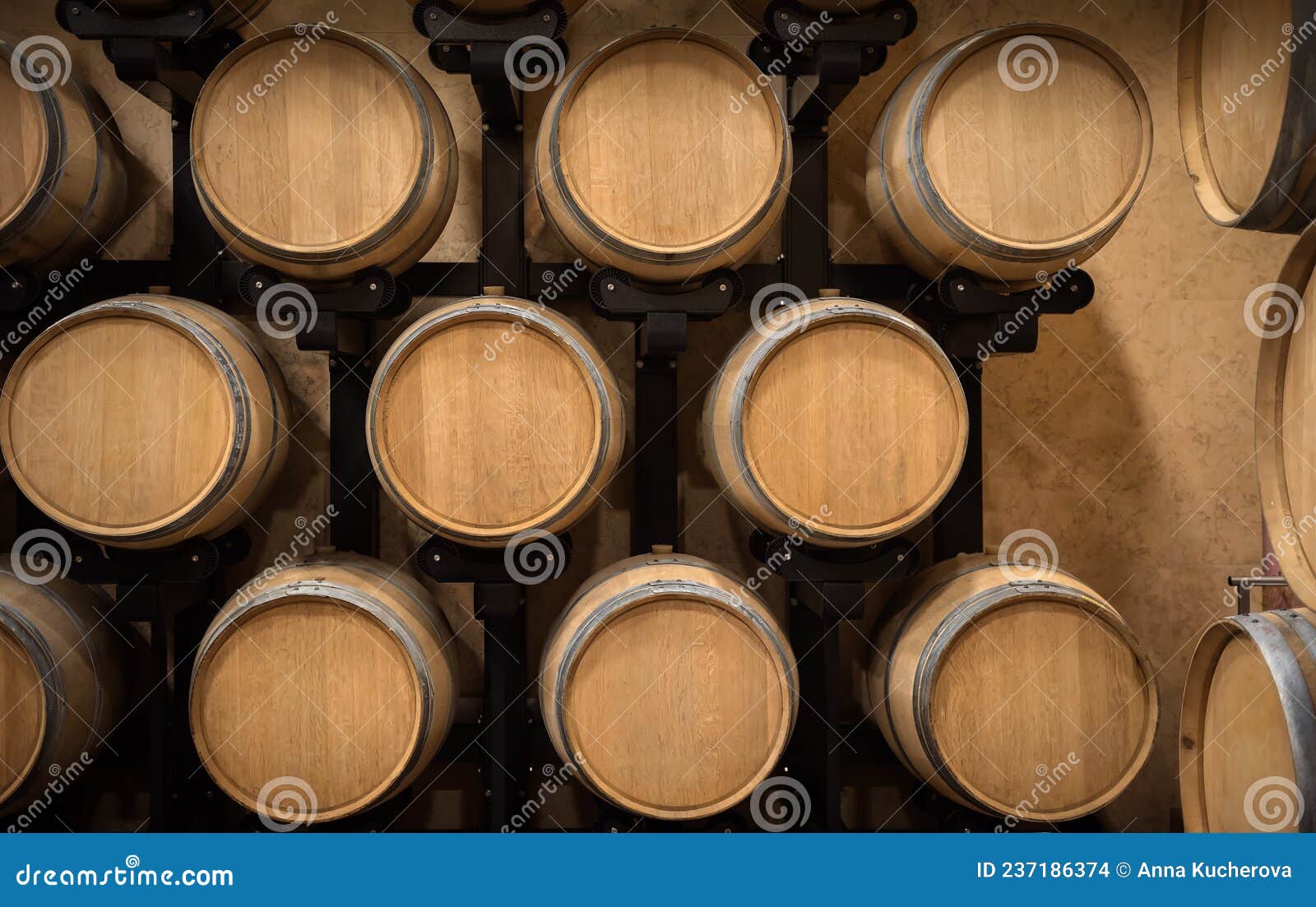 Wooden Wine Barrels in a Row in Winery Cellar Stock Photo - Image of ...