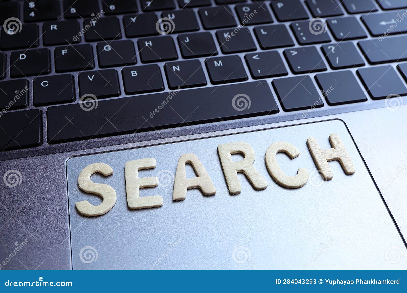 Wooden Word with the Word "search" on a Laptop Computer. Search Engine ...