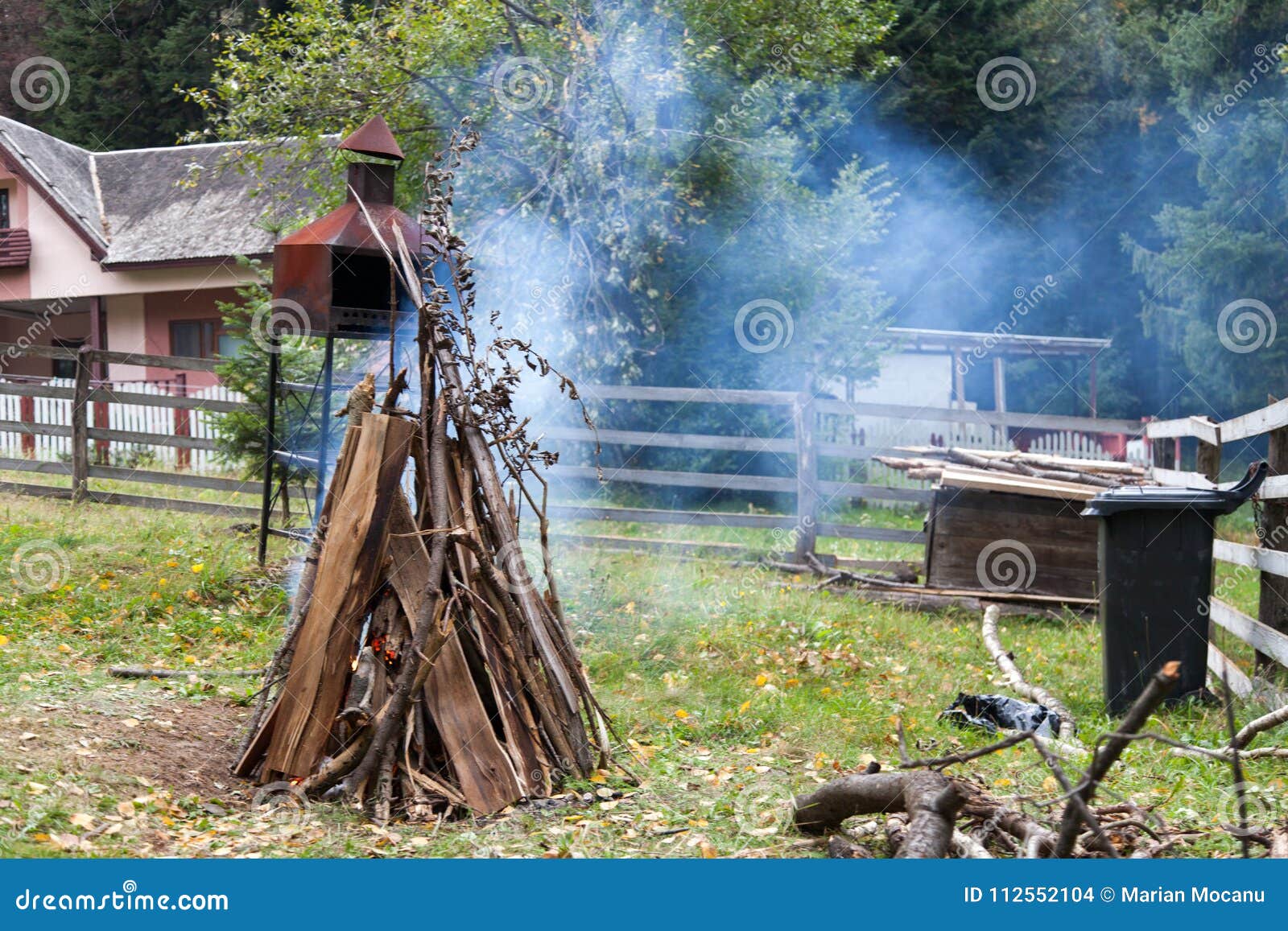 Start campfire in a garden stock photo. Image of burning - 112552104