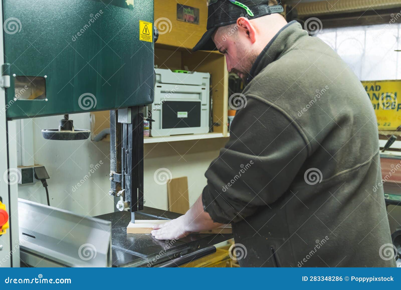 Woodworker Cutting Timber by Using Saw Blade Cutting Machine Stock ...