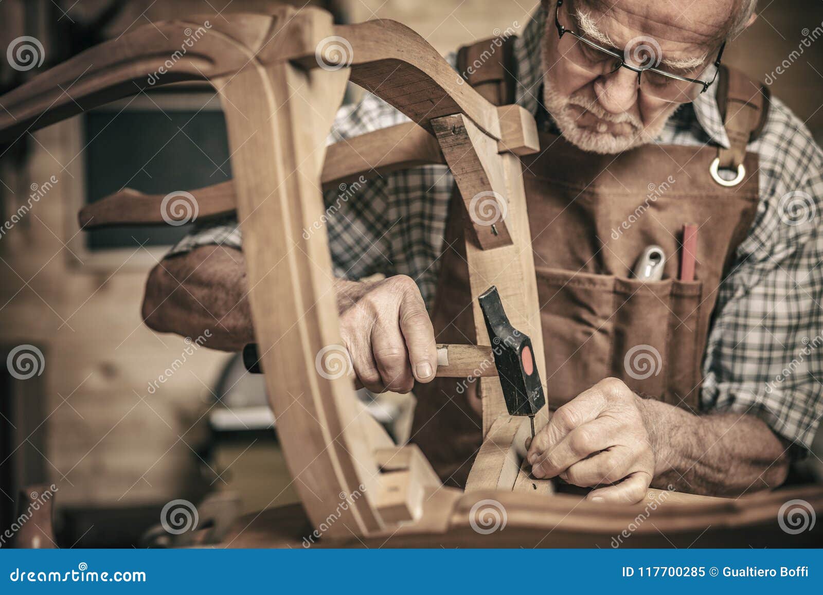 Woodworker in workshop stock image. Image of professional - 117700285