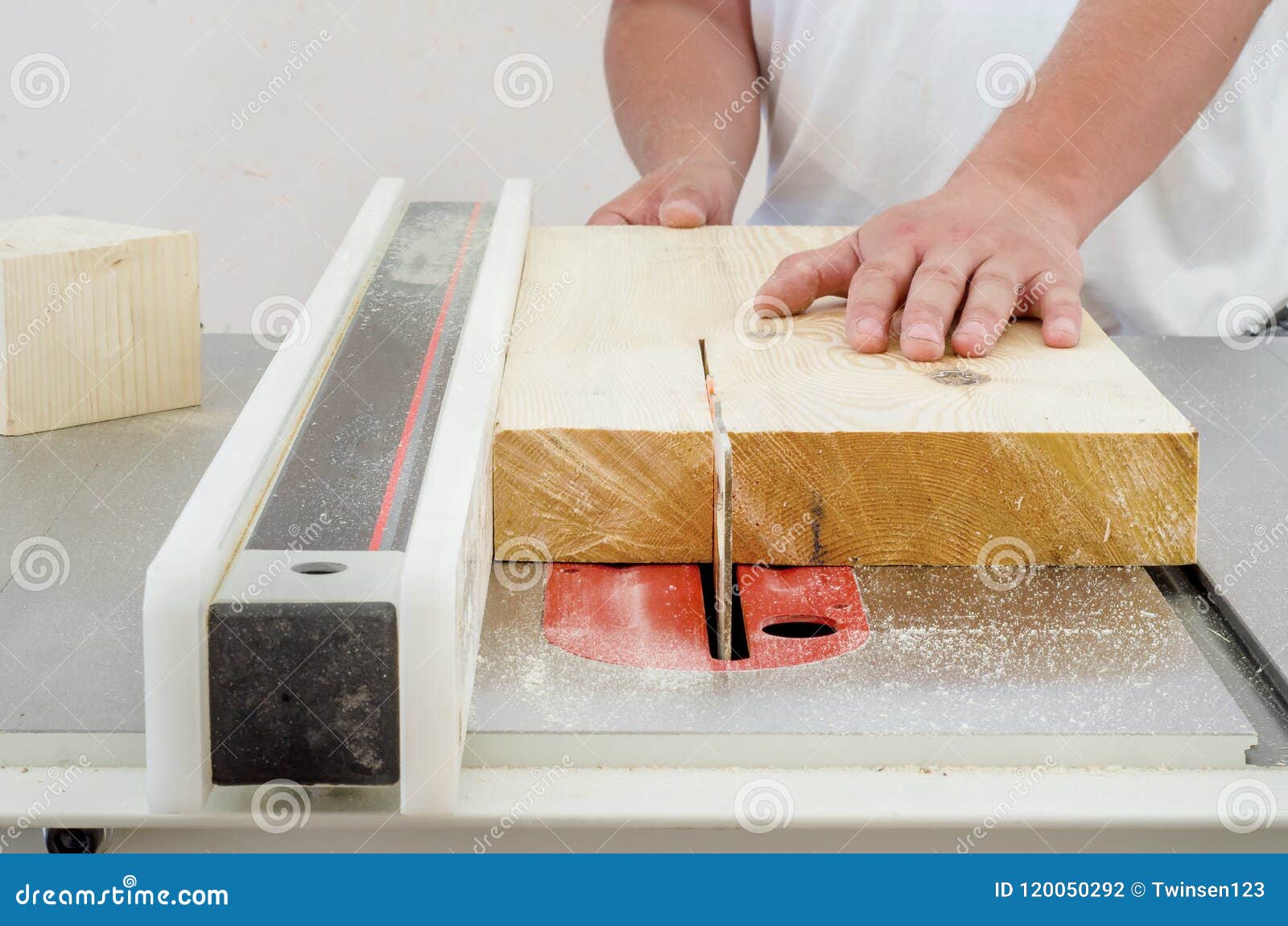Woodworking, a Man Cutting a Board on a Circular Saw Machine Stock ...