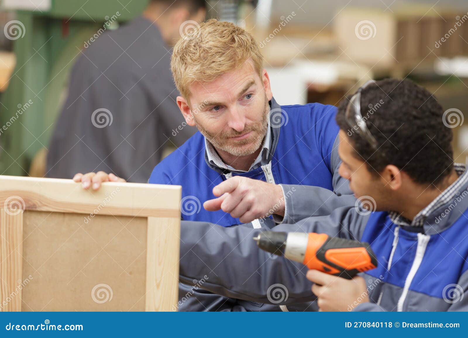 Woodworking Trainer Supervising Apprentice Stock Photo - Image of ...
