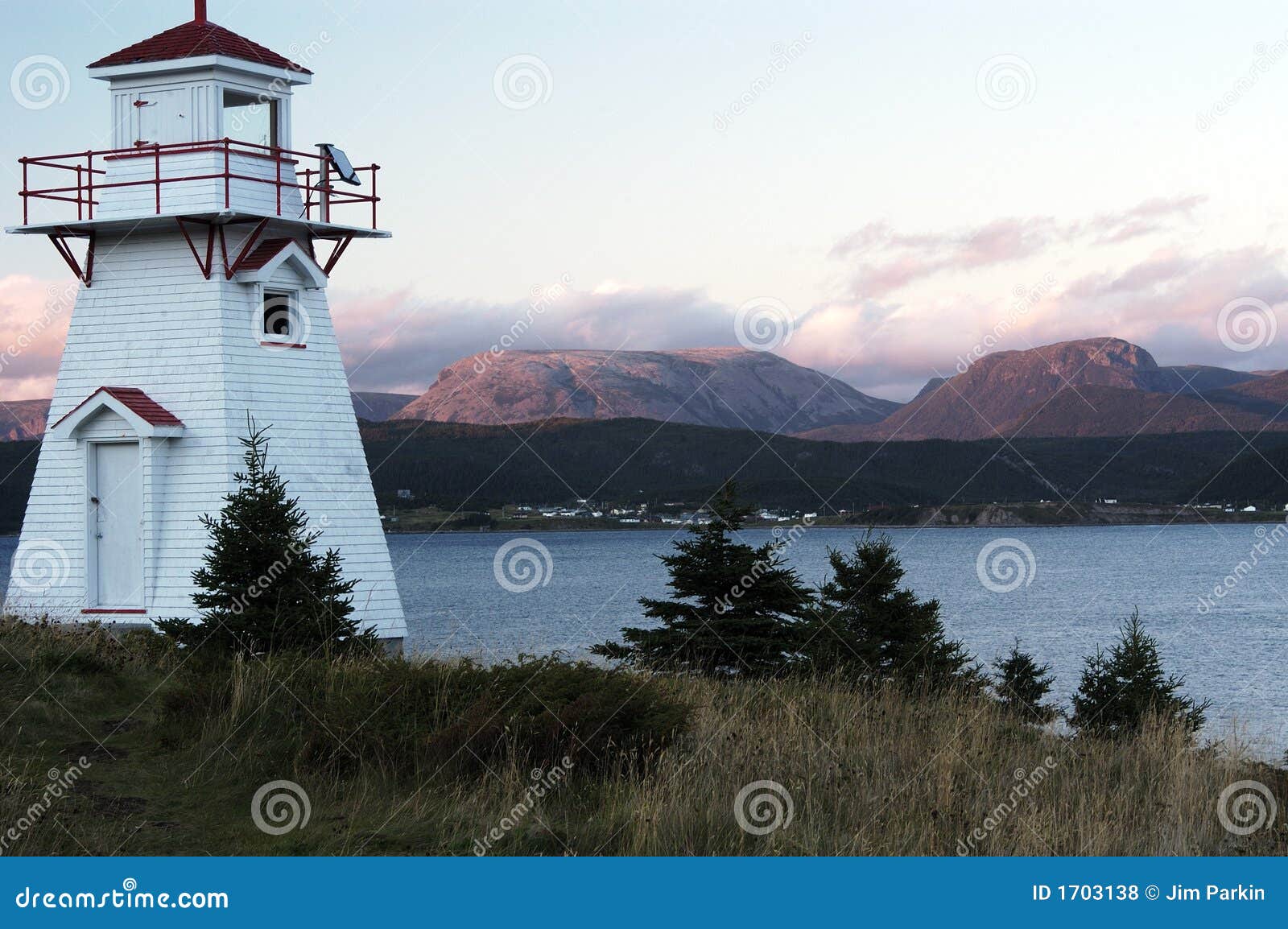 Woody Point Lighthouse, Sunset Stock Photo - Image of beach, landmark ...