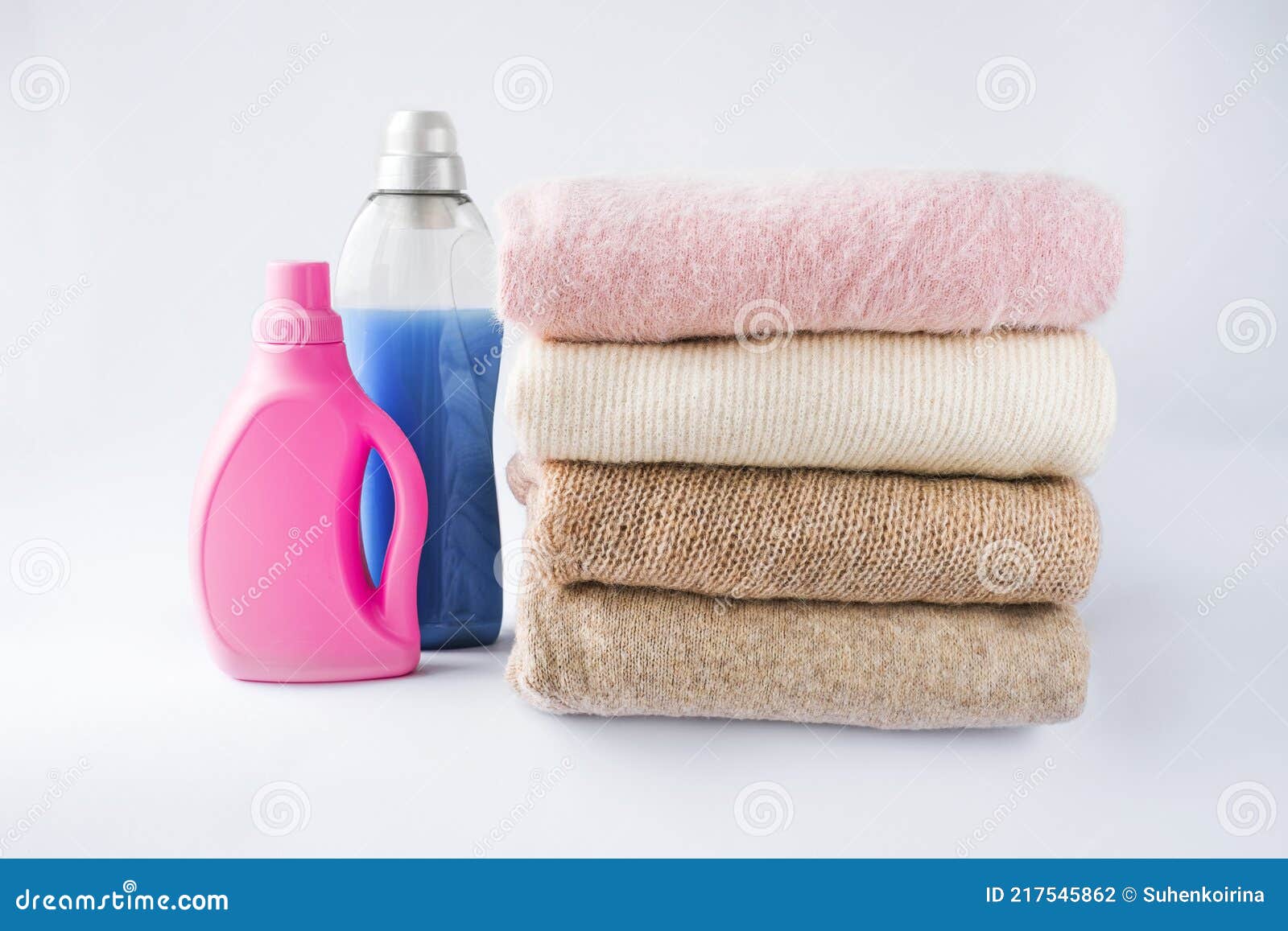 Woolen Clothes of Light Shades, Folded on a White Background Stock ...
