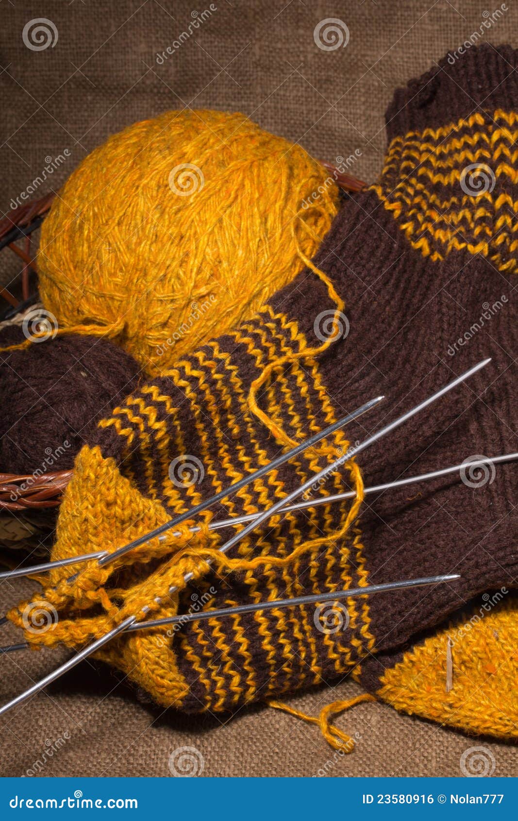 Woollen Scarf with Knitting Needles. Stock Photo - Image of orange ...