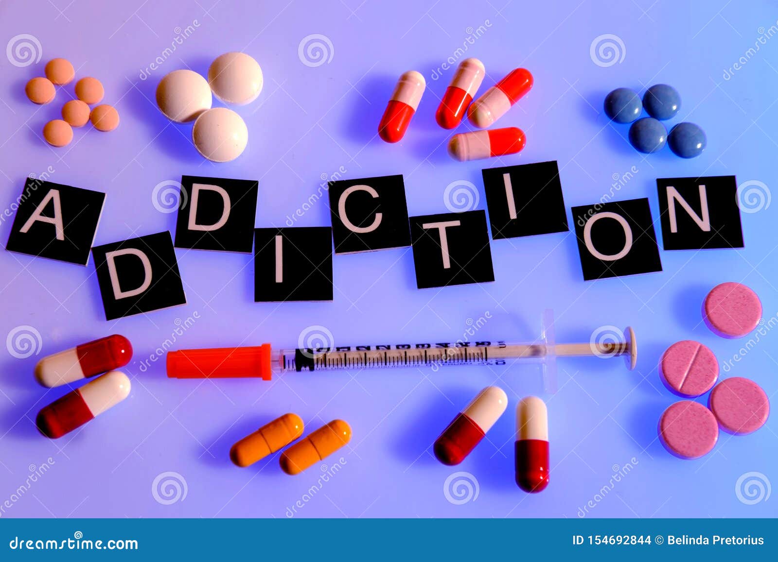 Word Addiction Surrounded by Medication and Syringe Stock Photo - Image ...