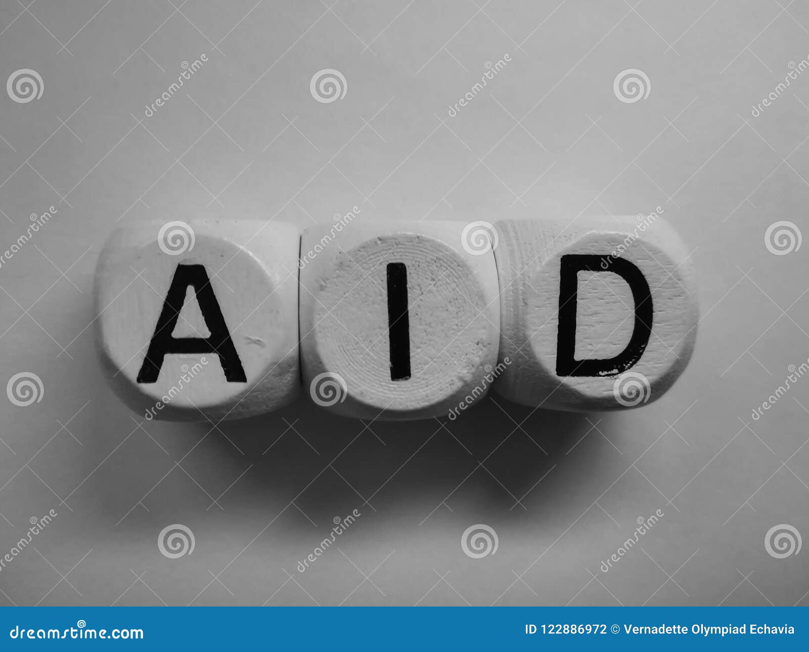 Word aid on wooden dice stock photo. Image of nineteenth - 122886972